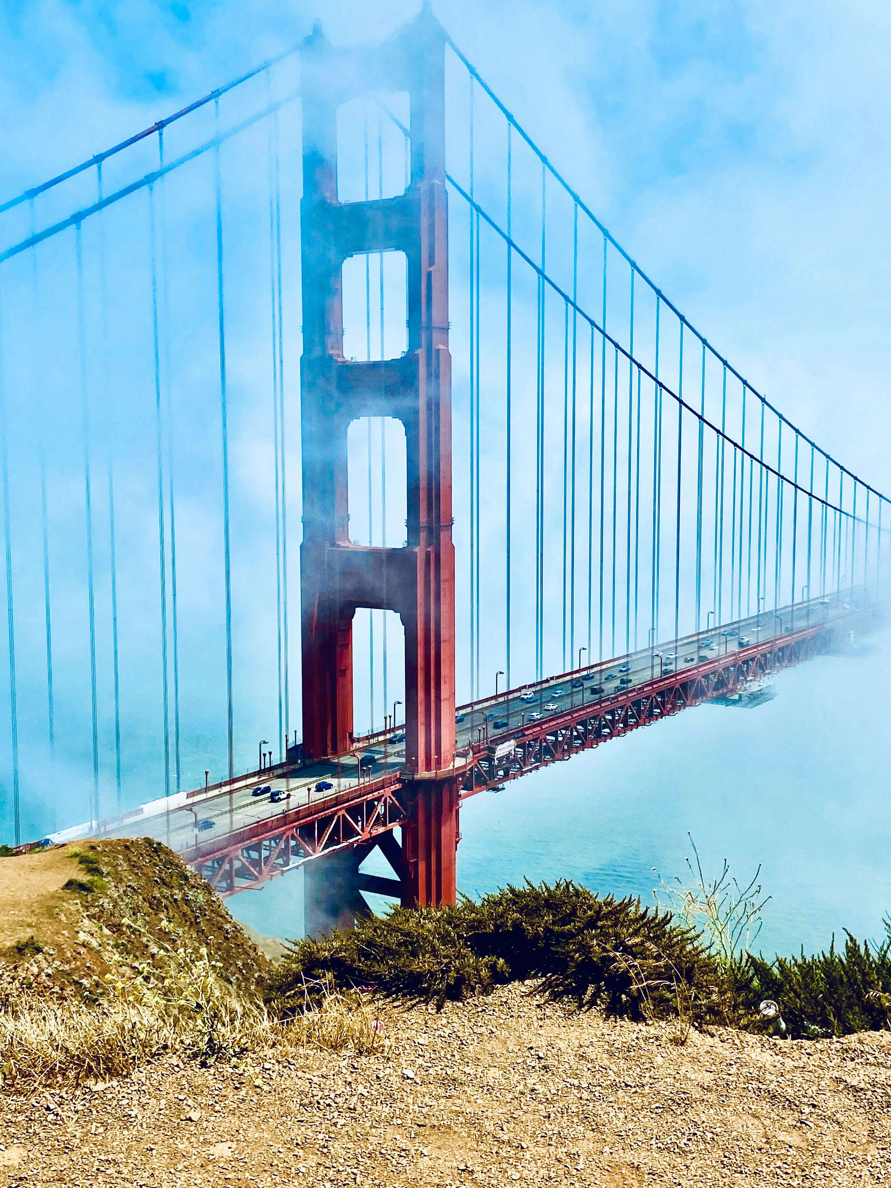 Red Span Through the Mist: Golden Gate Tower in San Francisco Fog
