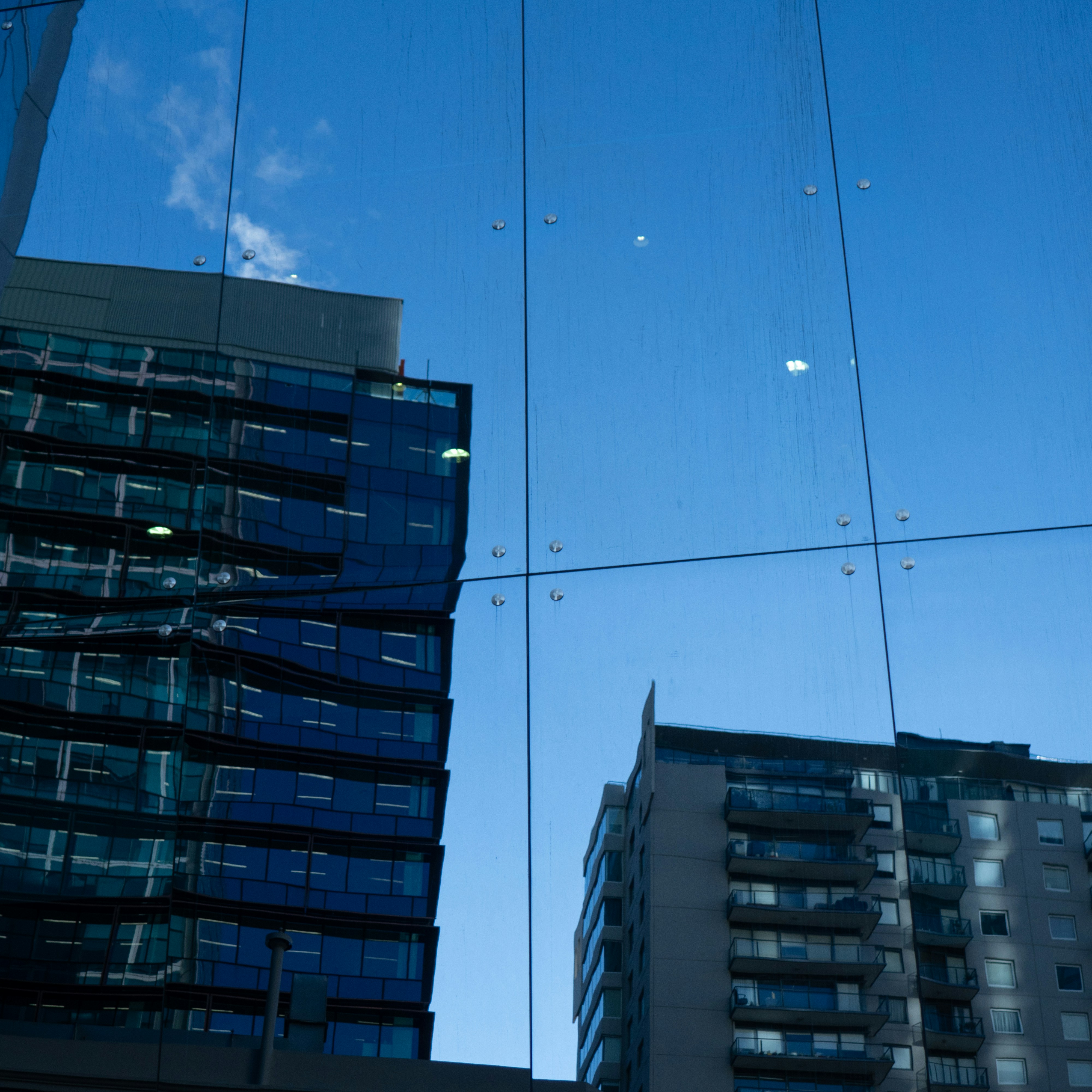 Azure Gridlines: Reflections Across a Glass Facade