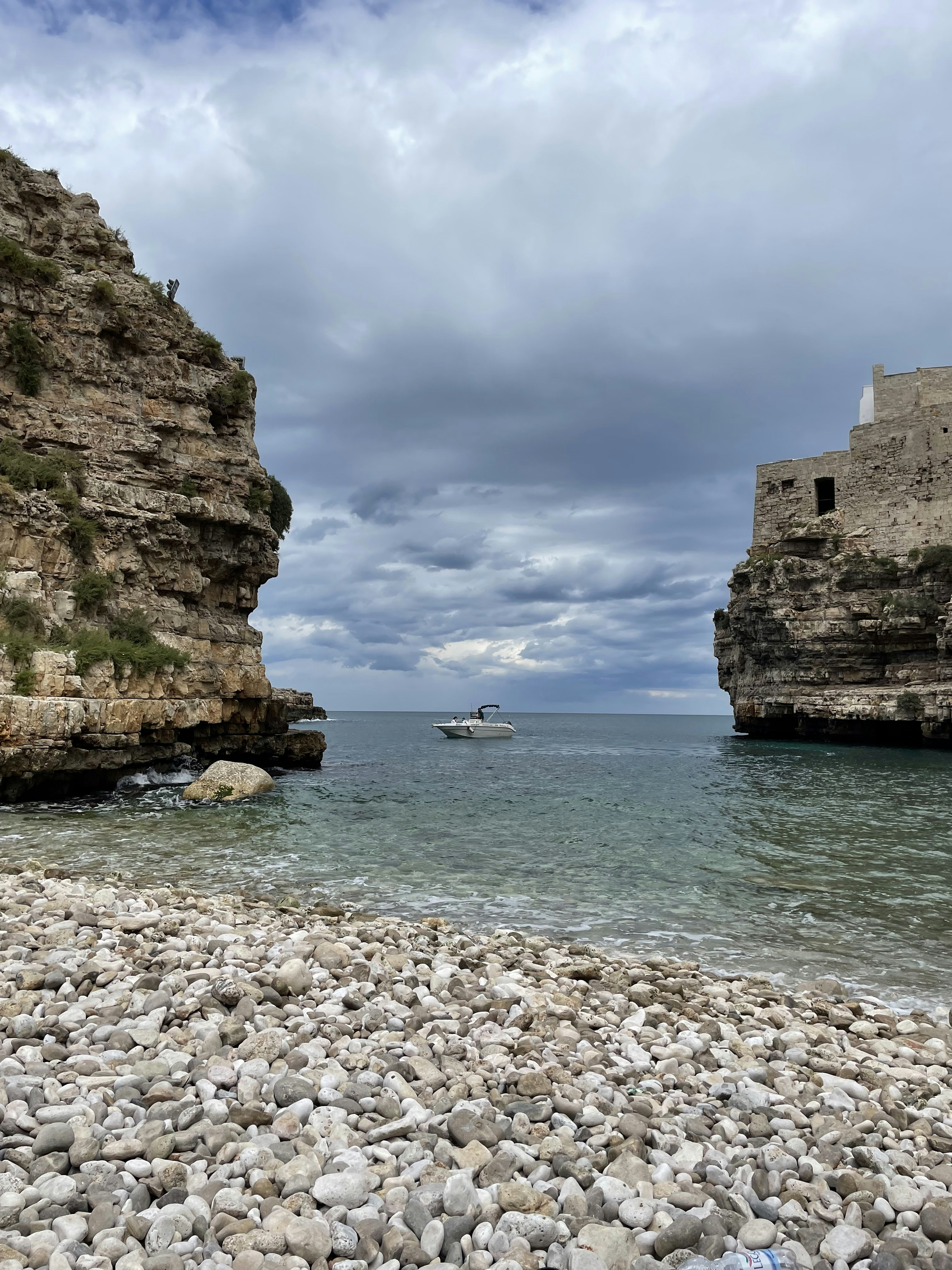 Boat Between Cliffs: A Quiet Sea Gate