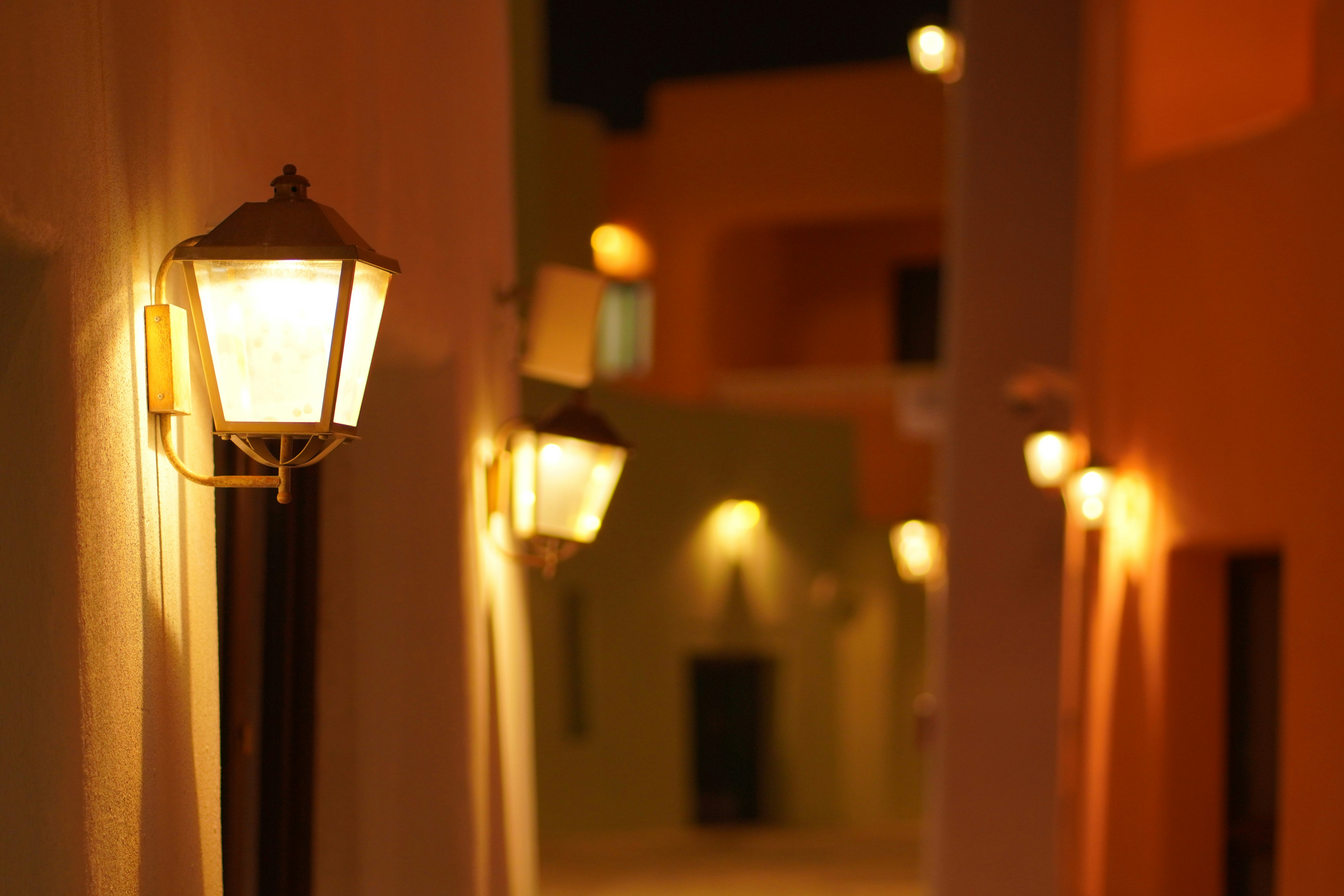A street light on the side of a building photo – Free Old doha port ...