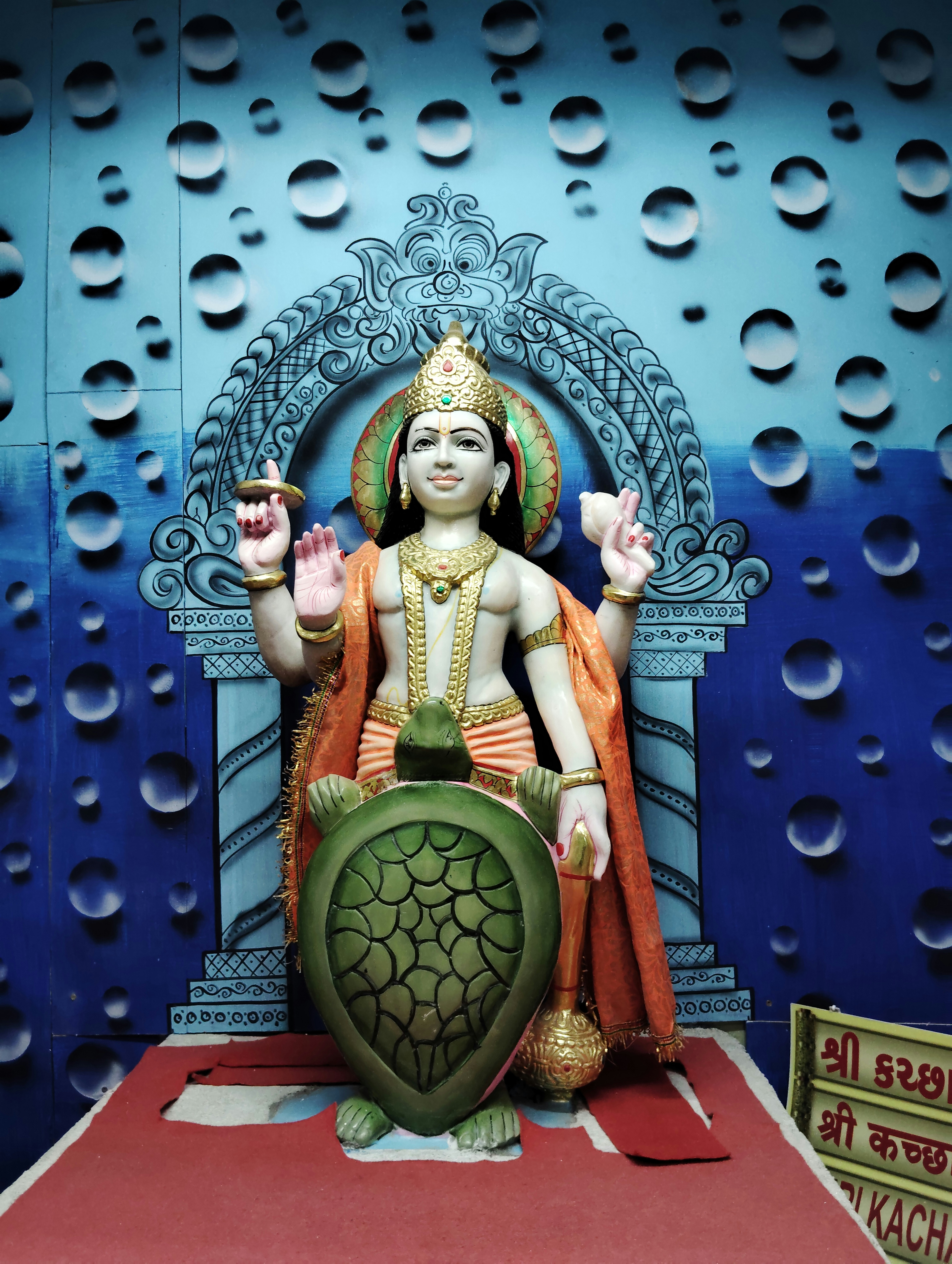 A statue of a hindu god sitting on a throne photo – Free Woman Image on ...