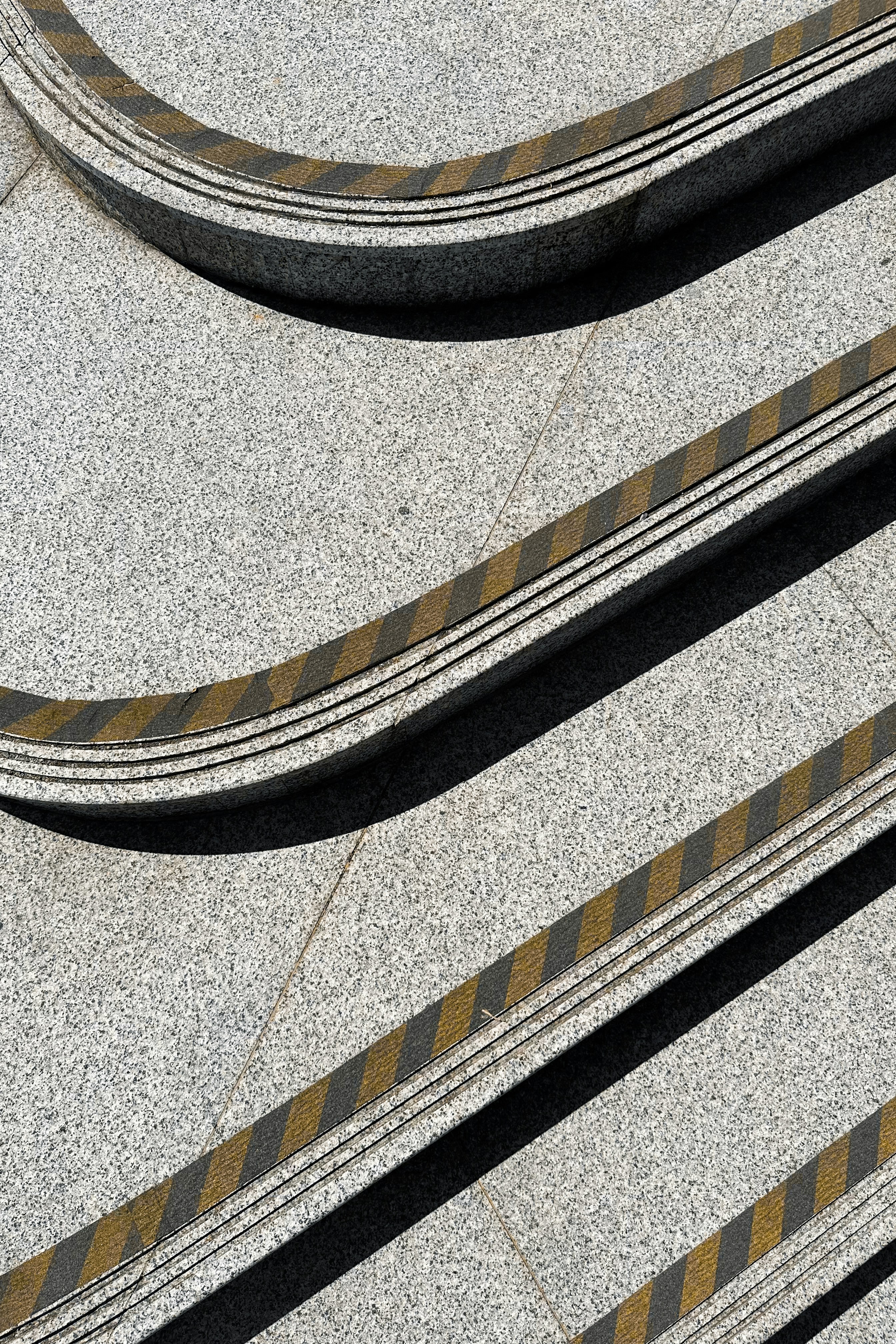 Diagonal Echoes on Curved Concrete: Stripes, Stone, and Shadow