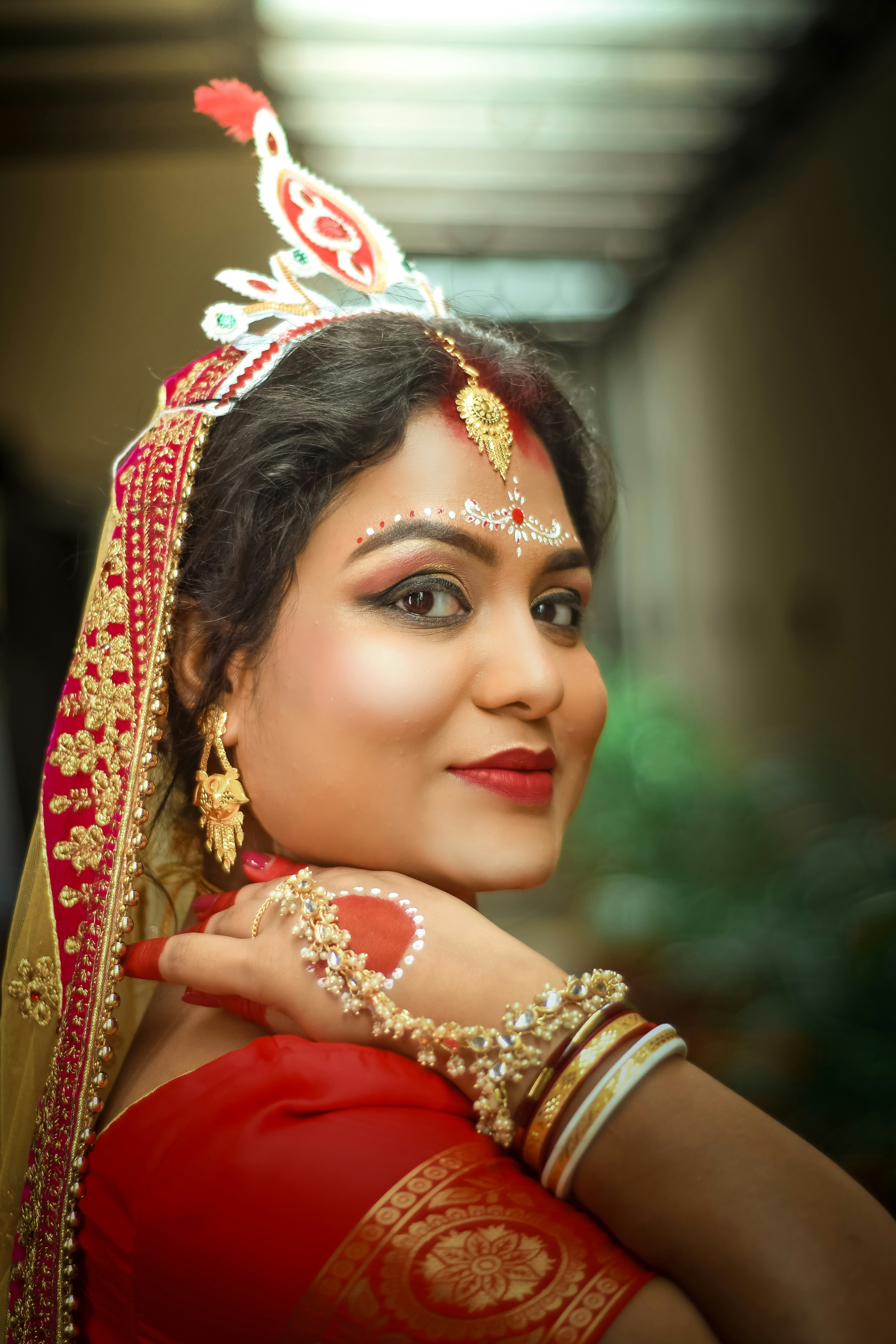 A woman in a red and gold outfit photo – Free Indian girl Image on Unsplash