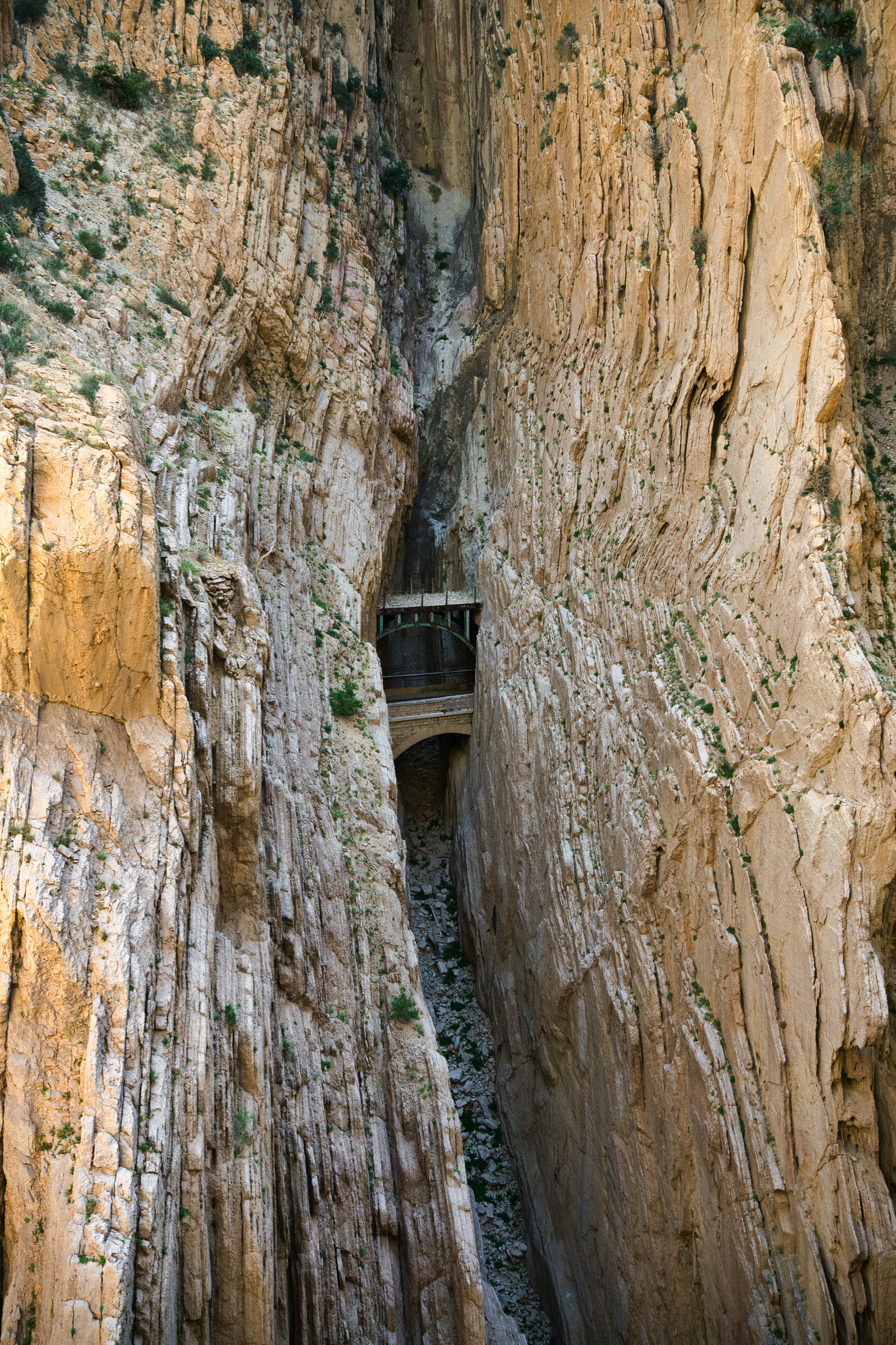 A narrow tunnel in the side of a mountain