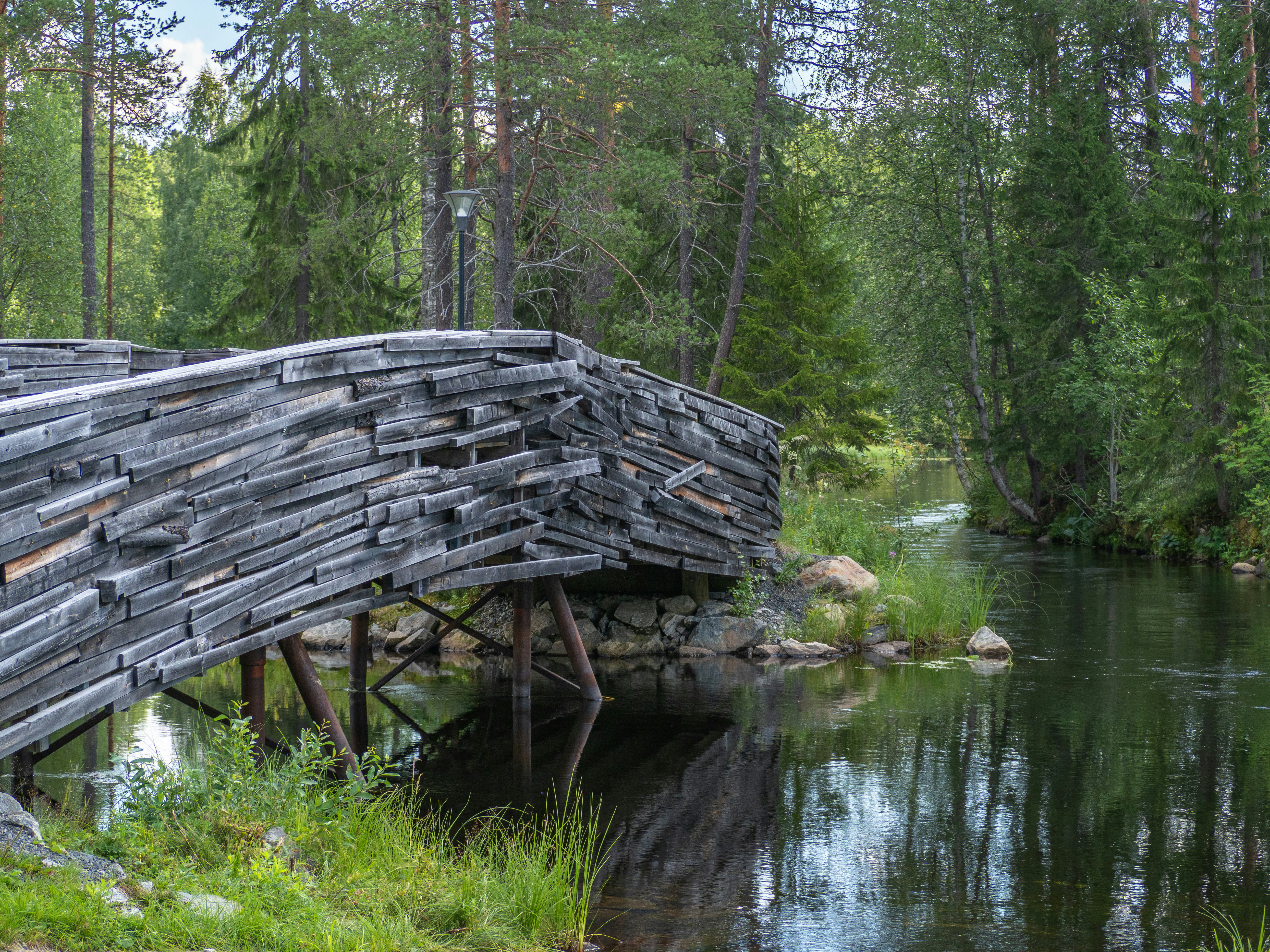 Slate-arched Bridge Over a Quiet Forest River