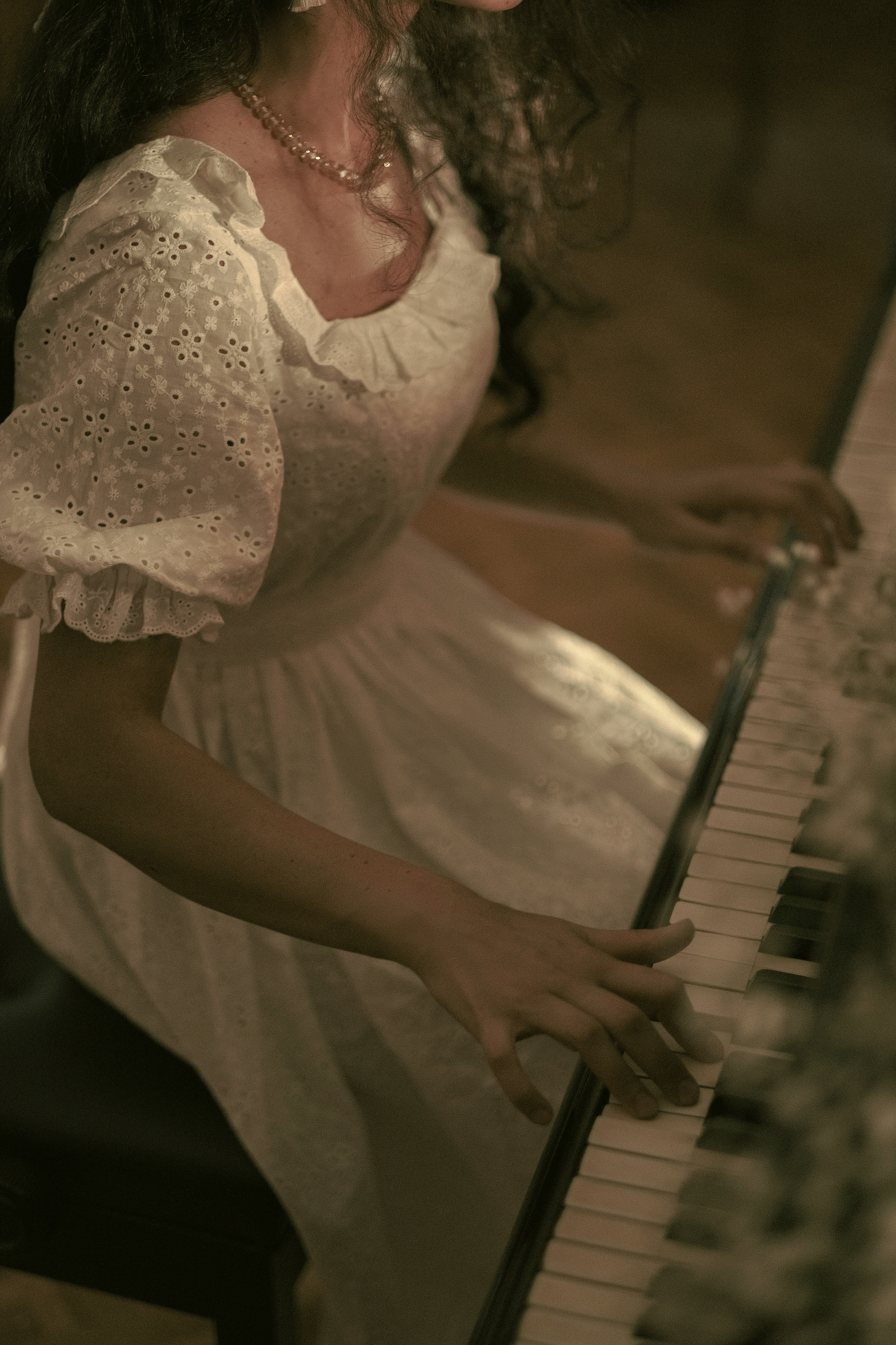 Whispered Melodies: A Quiet Moment at the Piano