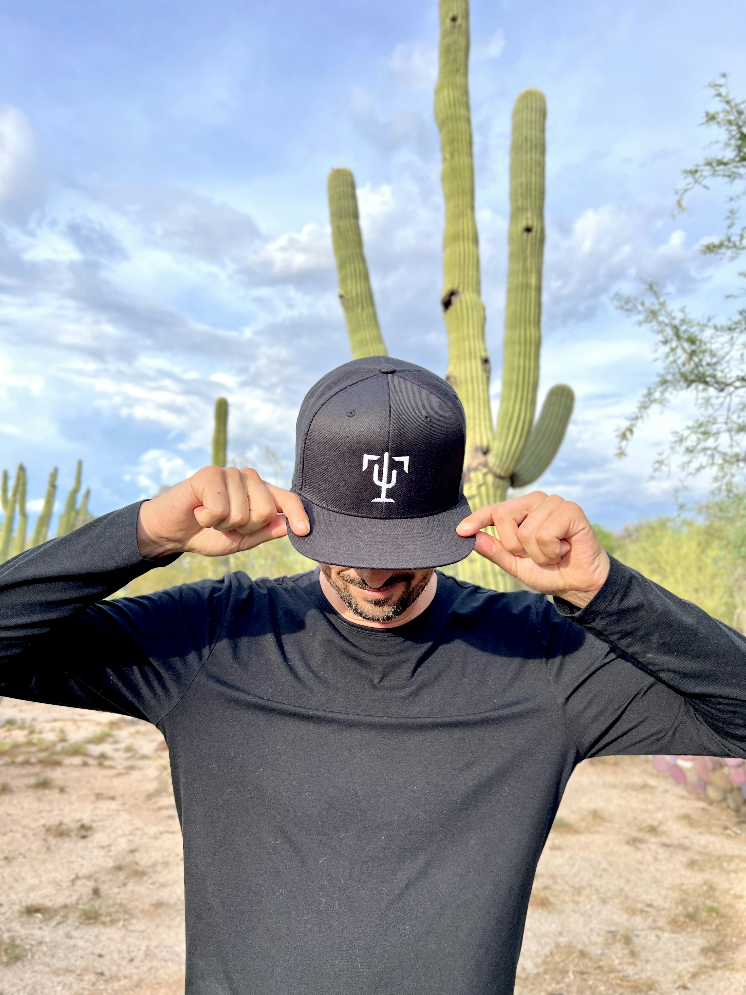 Desert Spotlight: Centered Cap Emblem Framing a Sunlit Moment