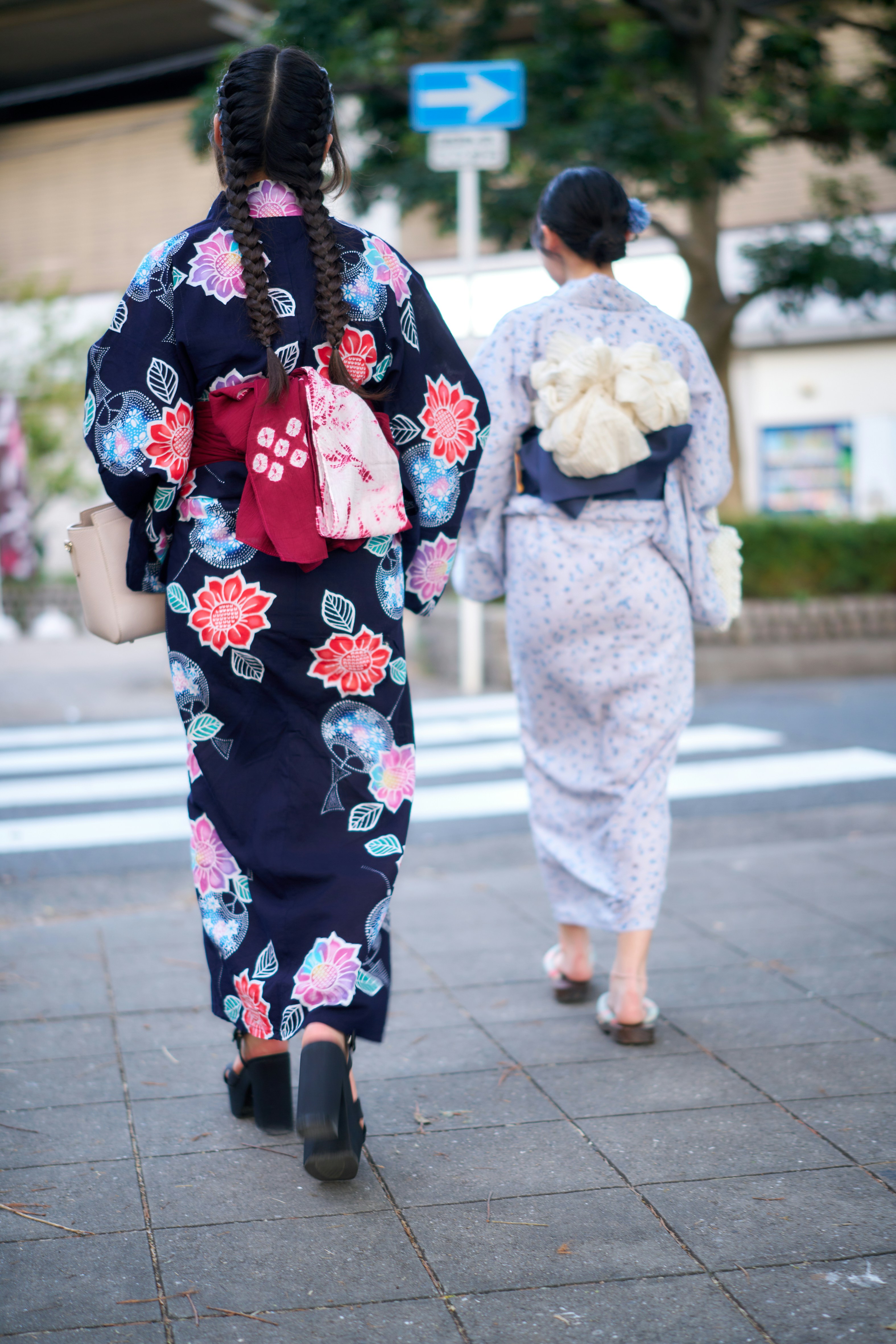 Blooming Silk on Asphalt: Two Kimono-Clad Women Crossing the City