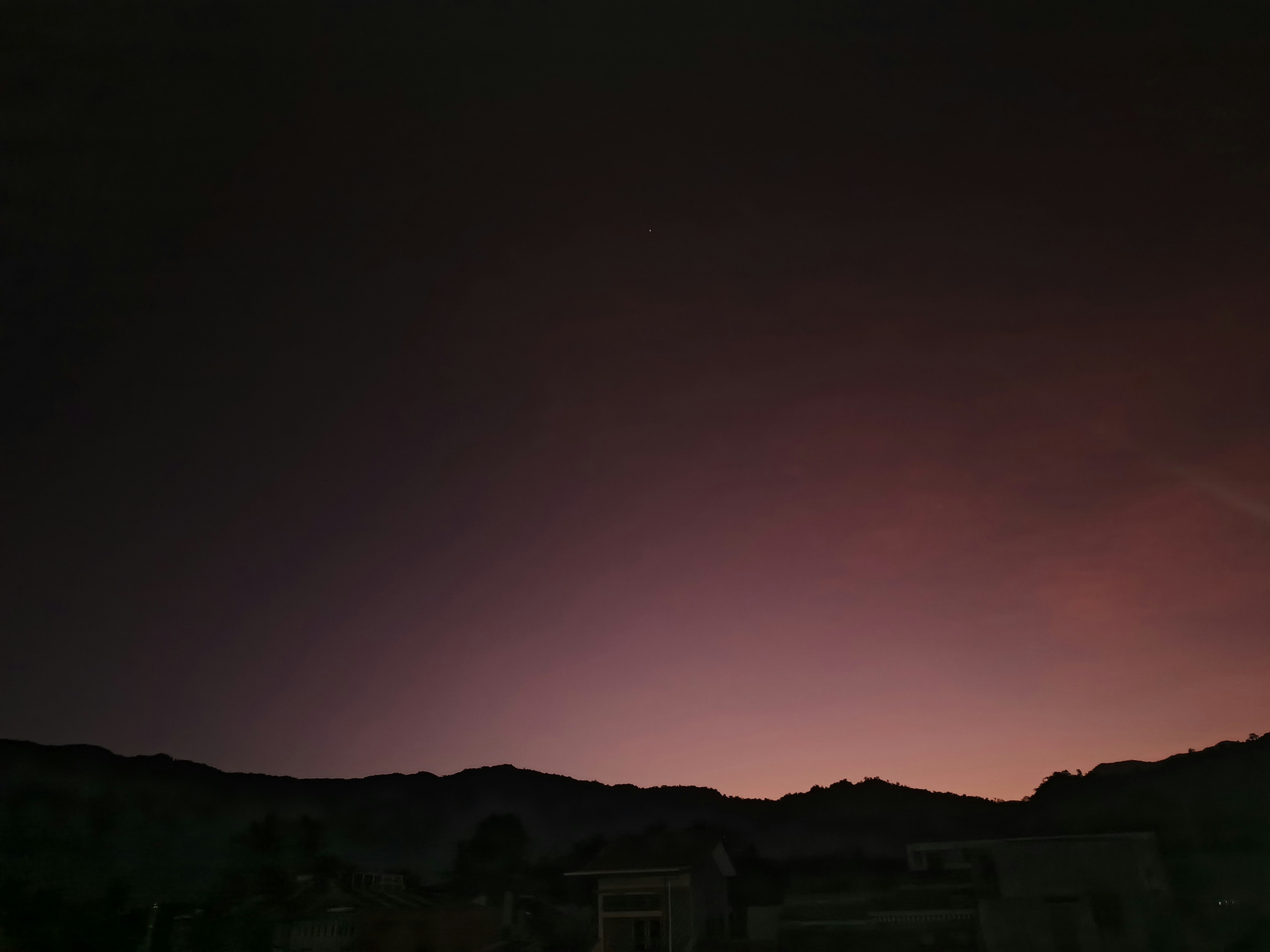 Ember Horizon Over a Quiet Ridge at Night