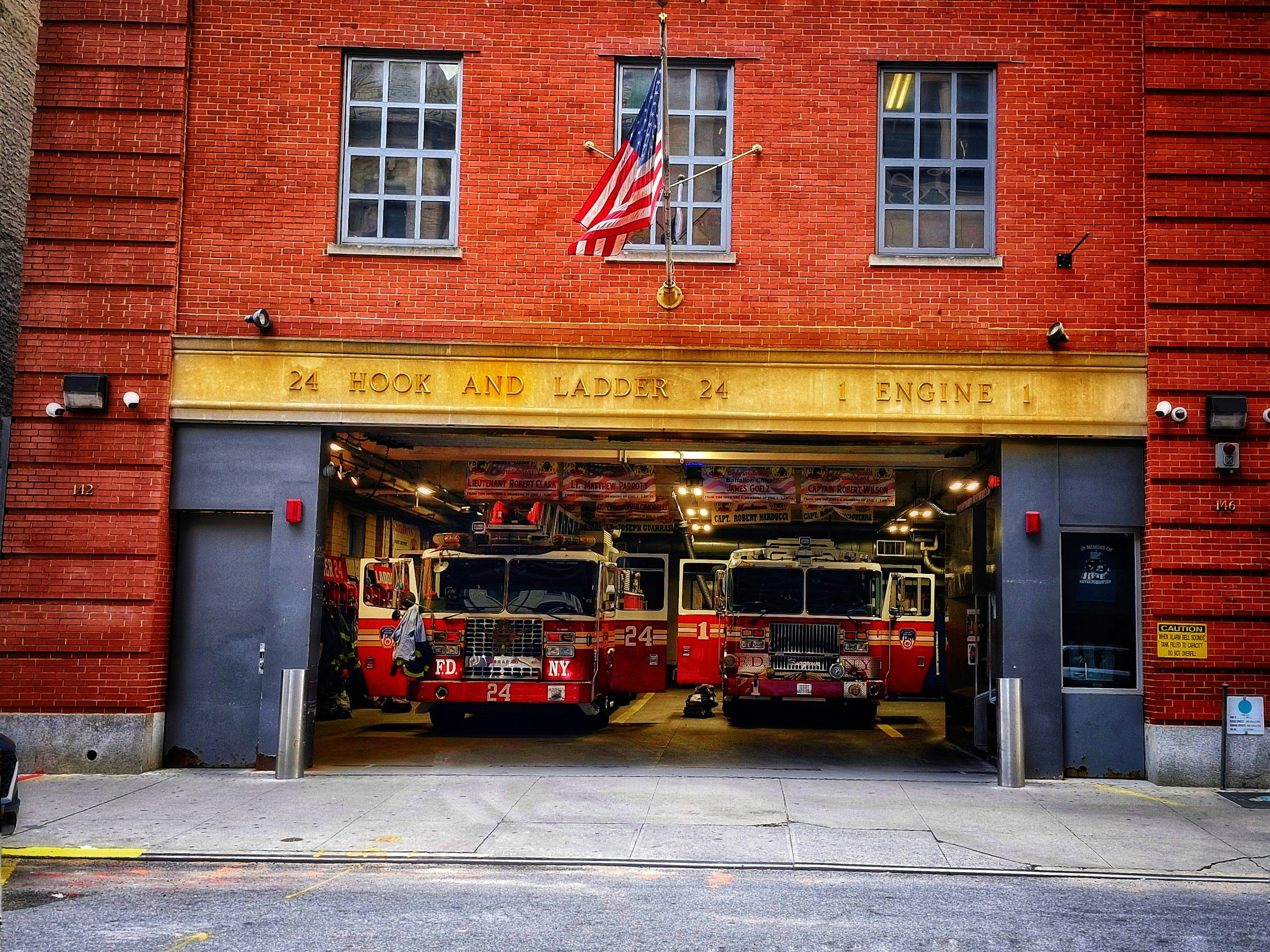 Two fire trucks parked in front of a fire station photo – Free New york ...