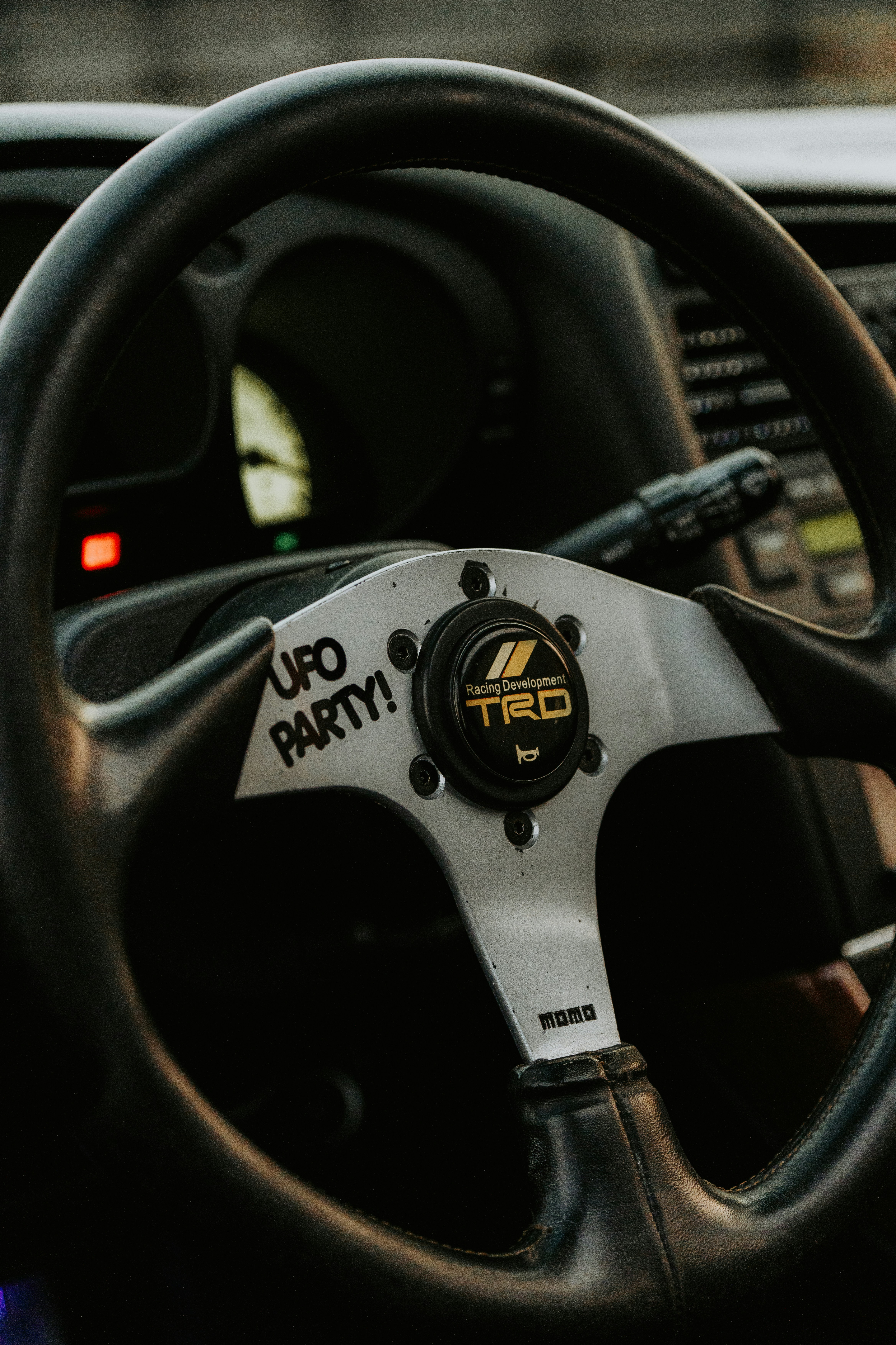 Momo Racing Wheel with TRD Crest and UFO PARTY! Sticker