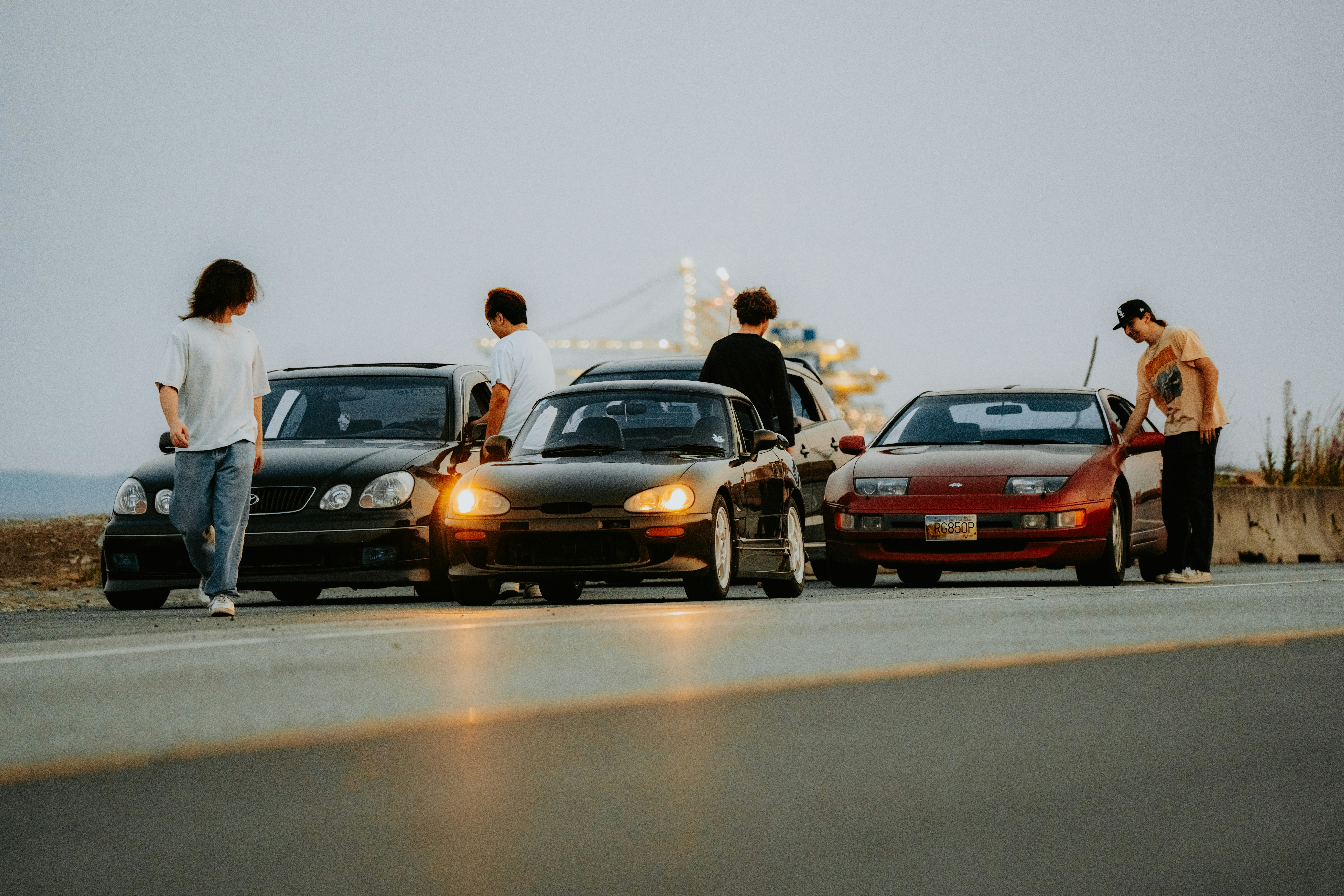 Tuned Lineup by the Pier: Friends, Taillights, and a Sunset