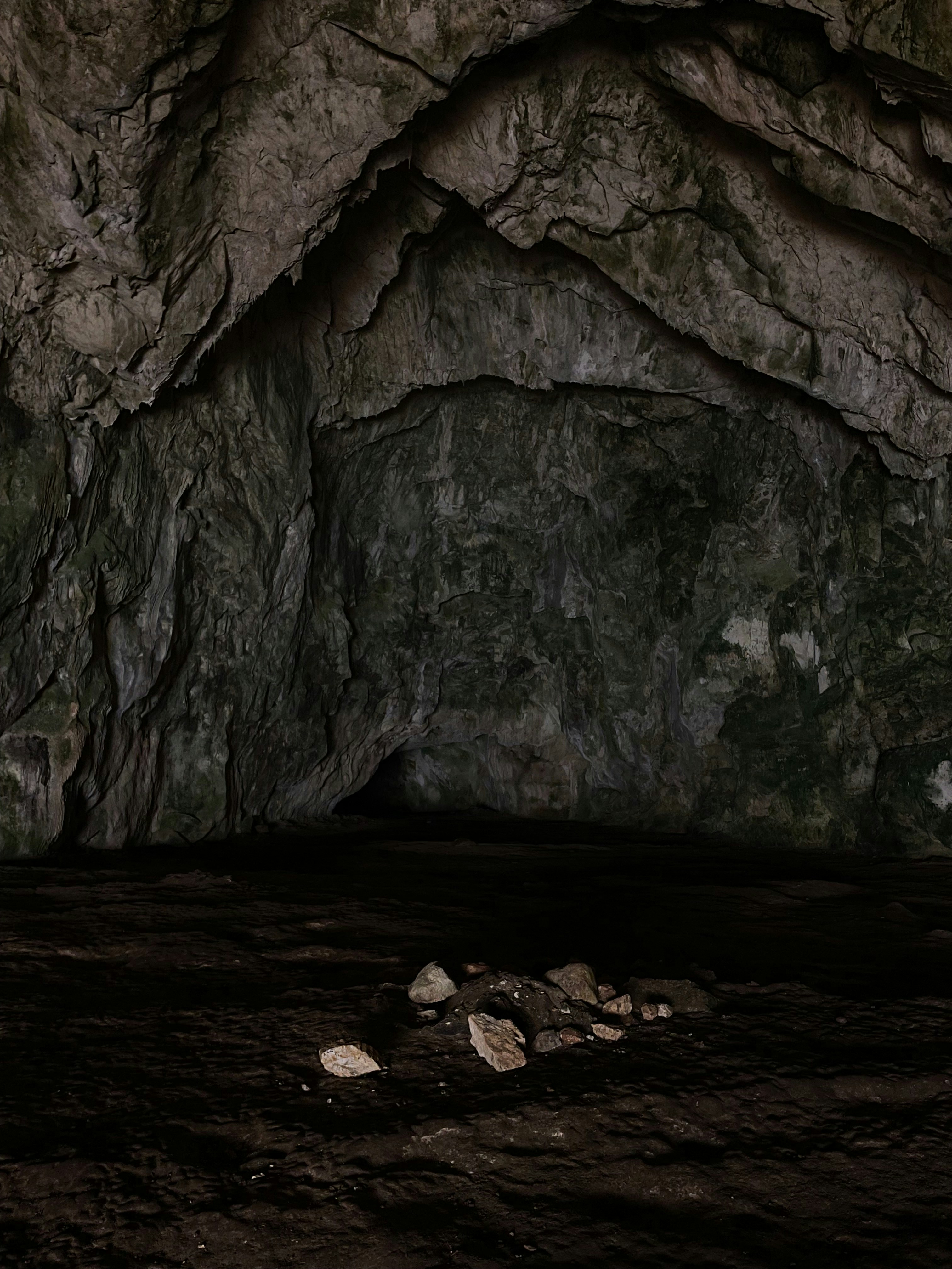 A cave filled with lots of rocks and rocks photo – Free Rock Image on ...