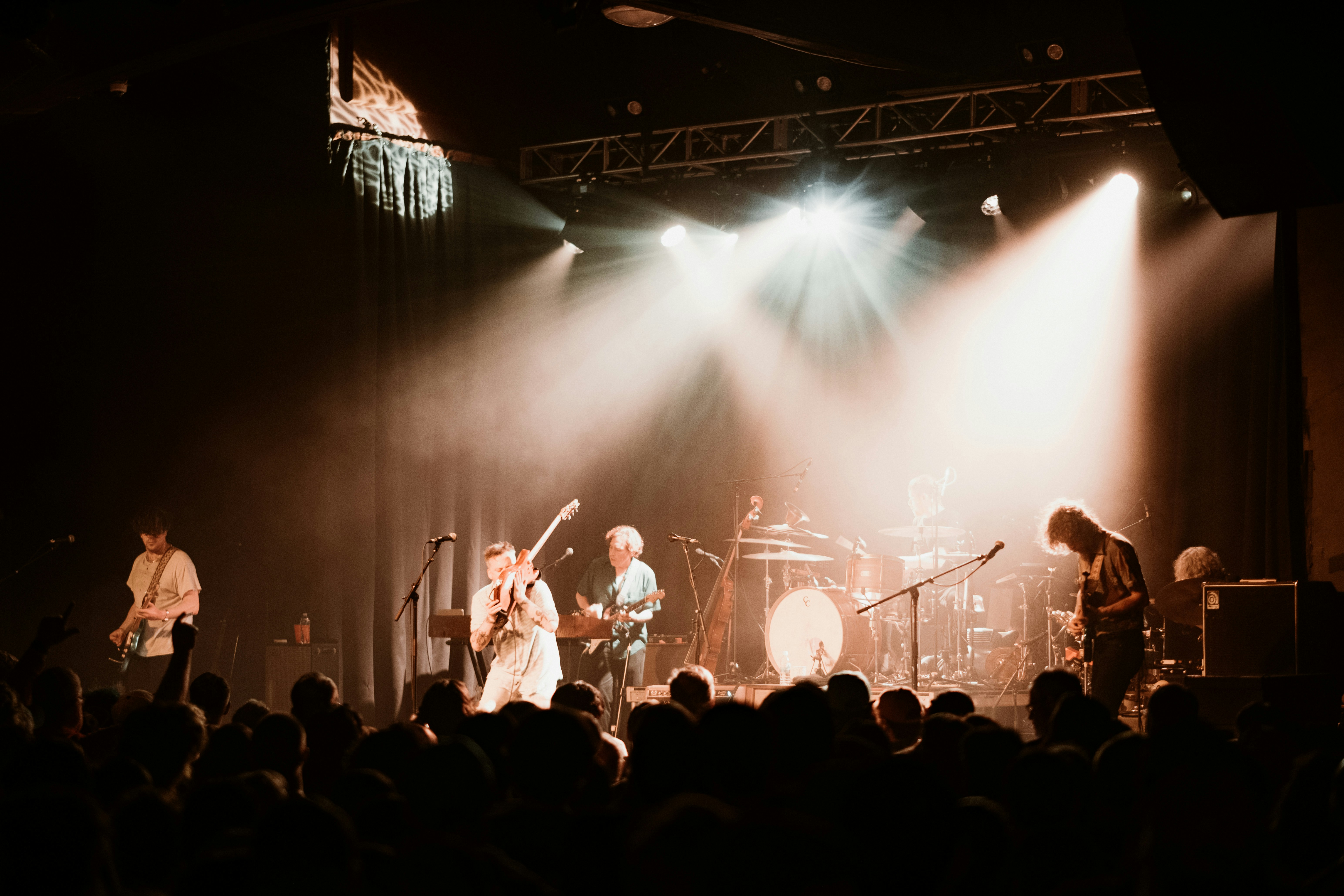 A group of people that are on a stage photo – Free Concert Image on ...