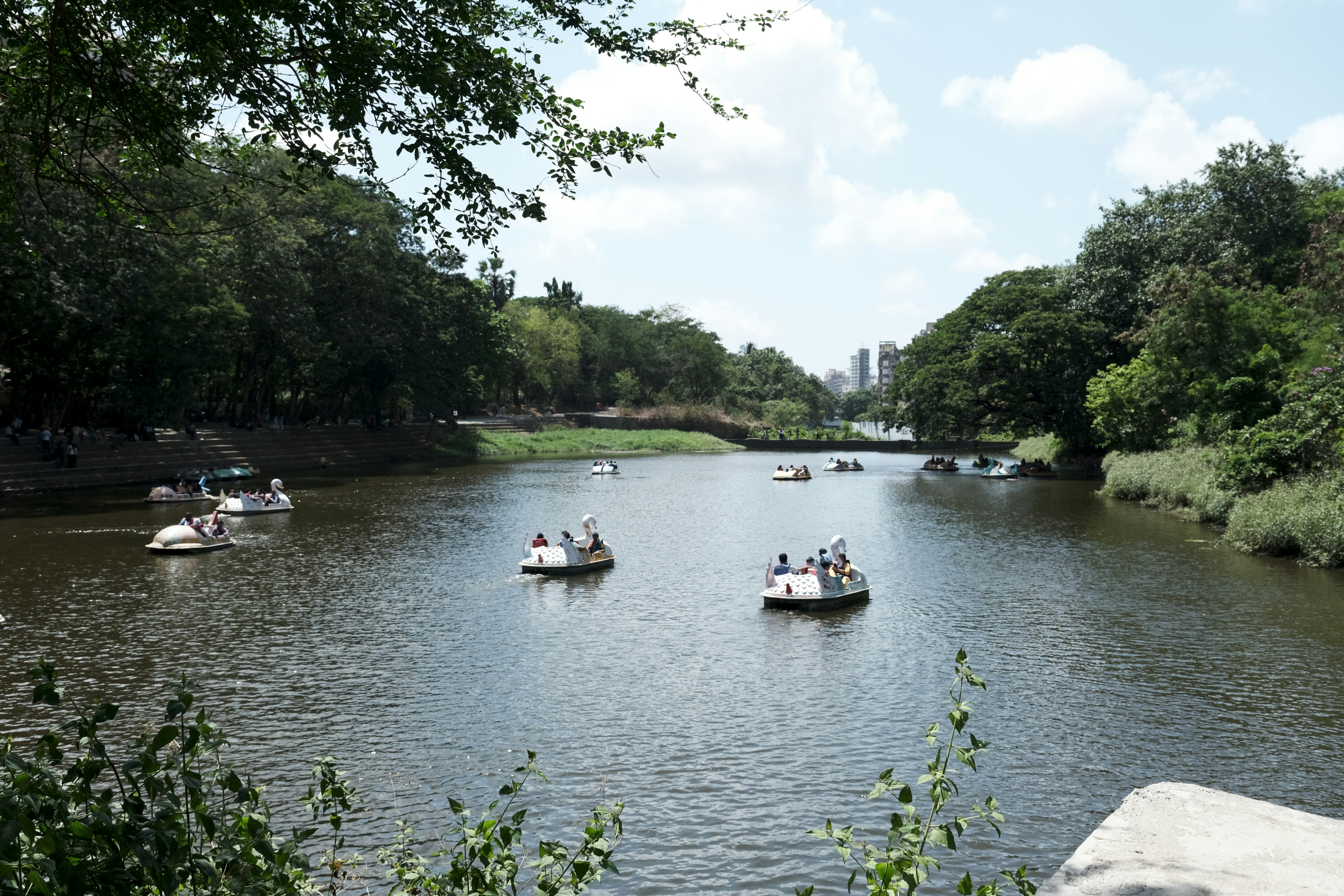 A group of boats floating on top of a river photo – Free Travel Image ...