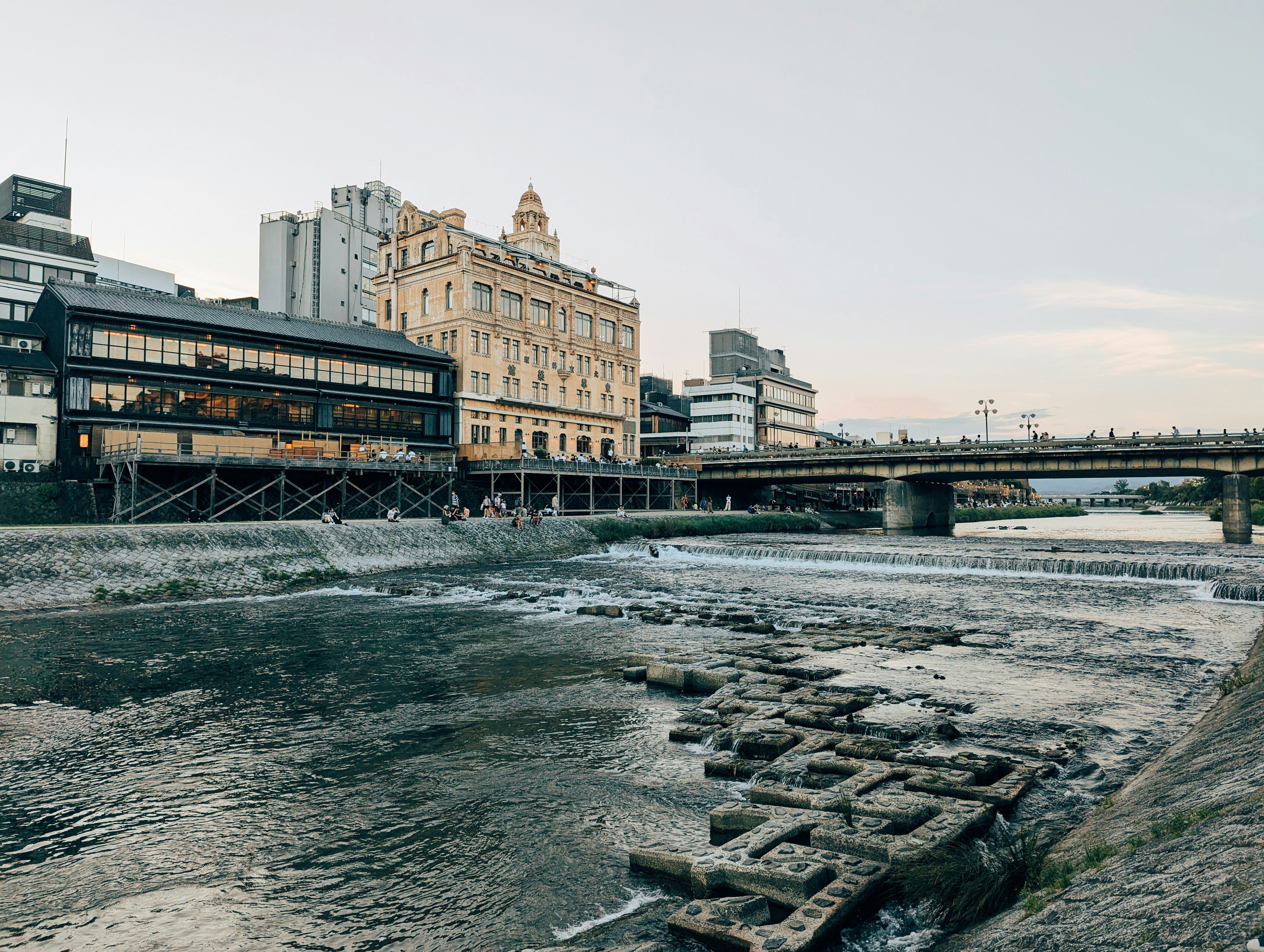 Clocktower by the River: Brick-and-Glass Cityscape
