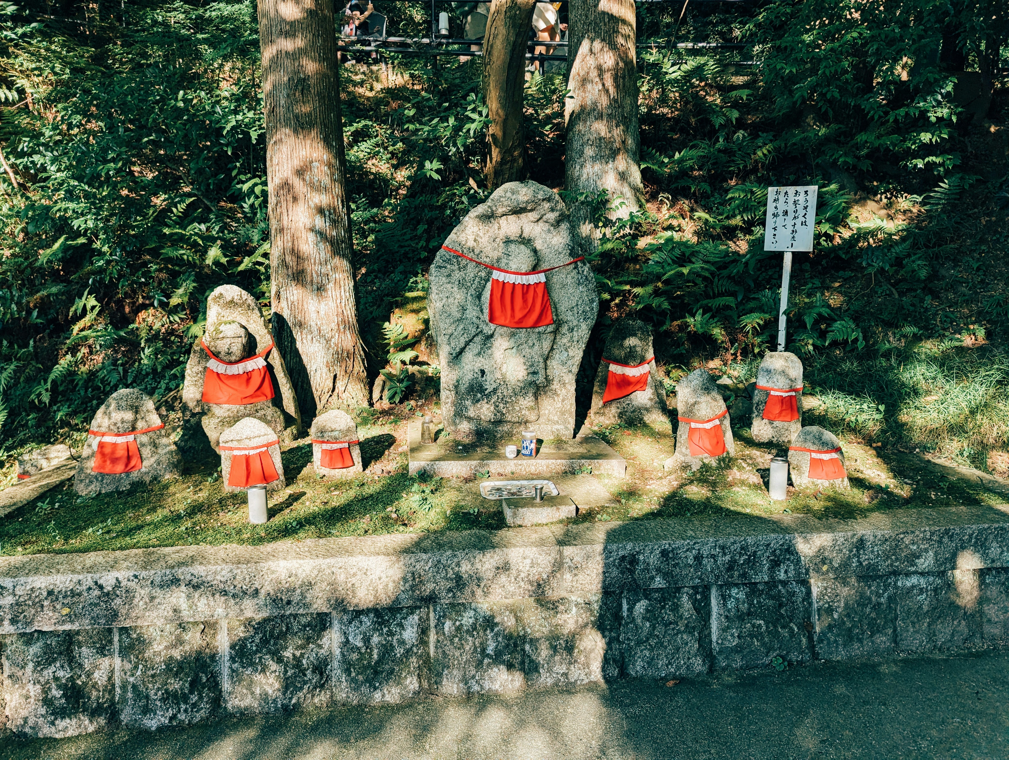 Shinto Stone Garden Watch: Miniature Lions in Red Ribbons