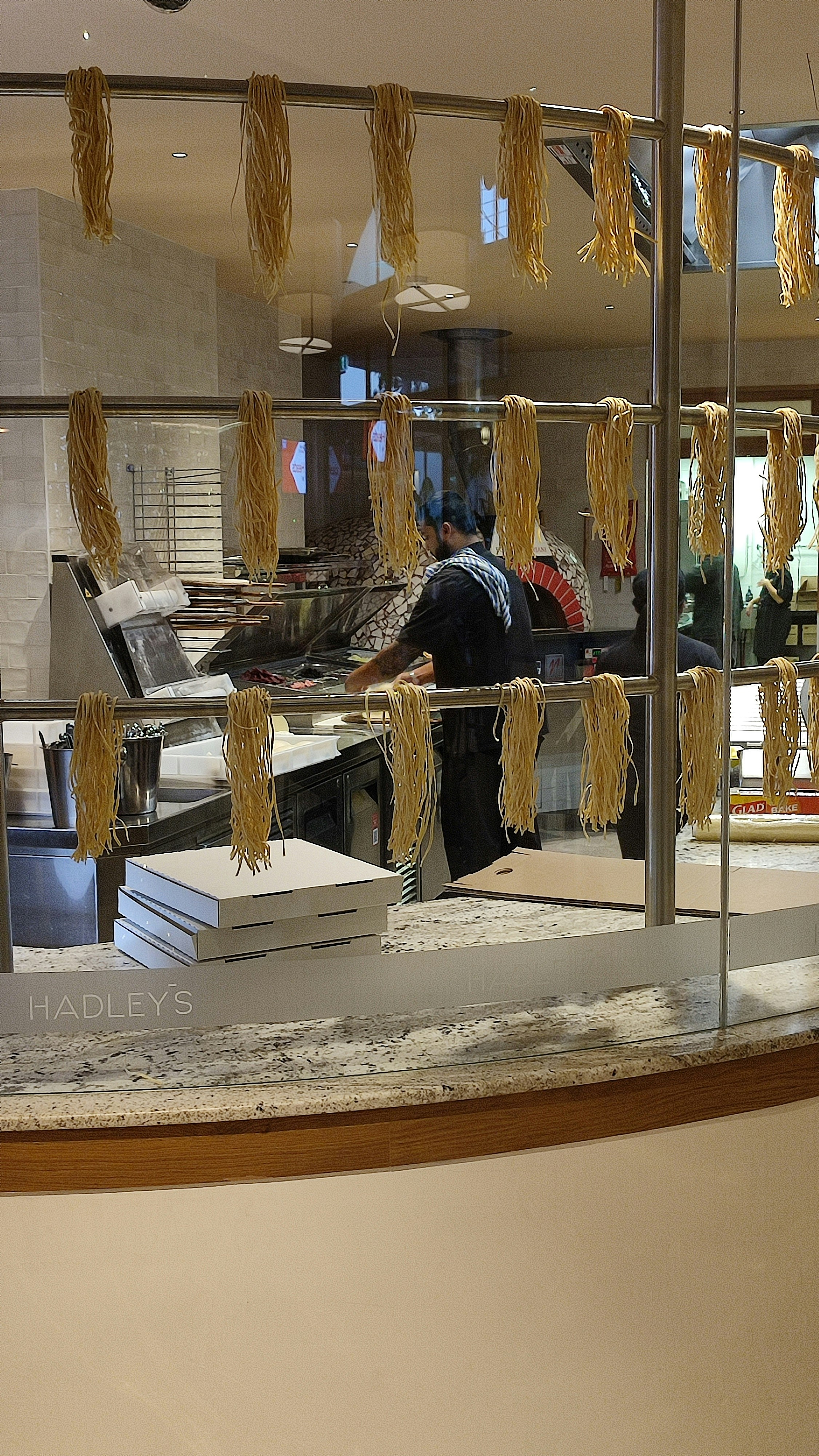 A display case with pasta hanging from it's sides photo – Free Terrigal ...