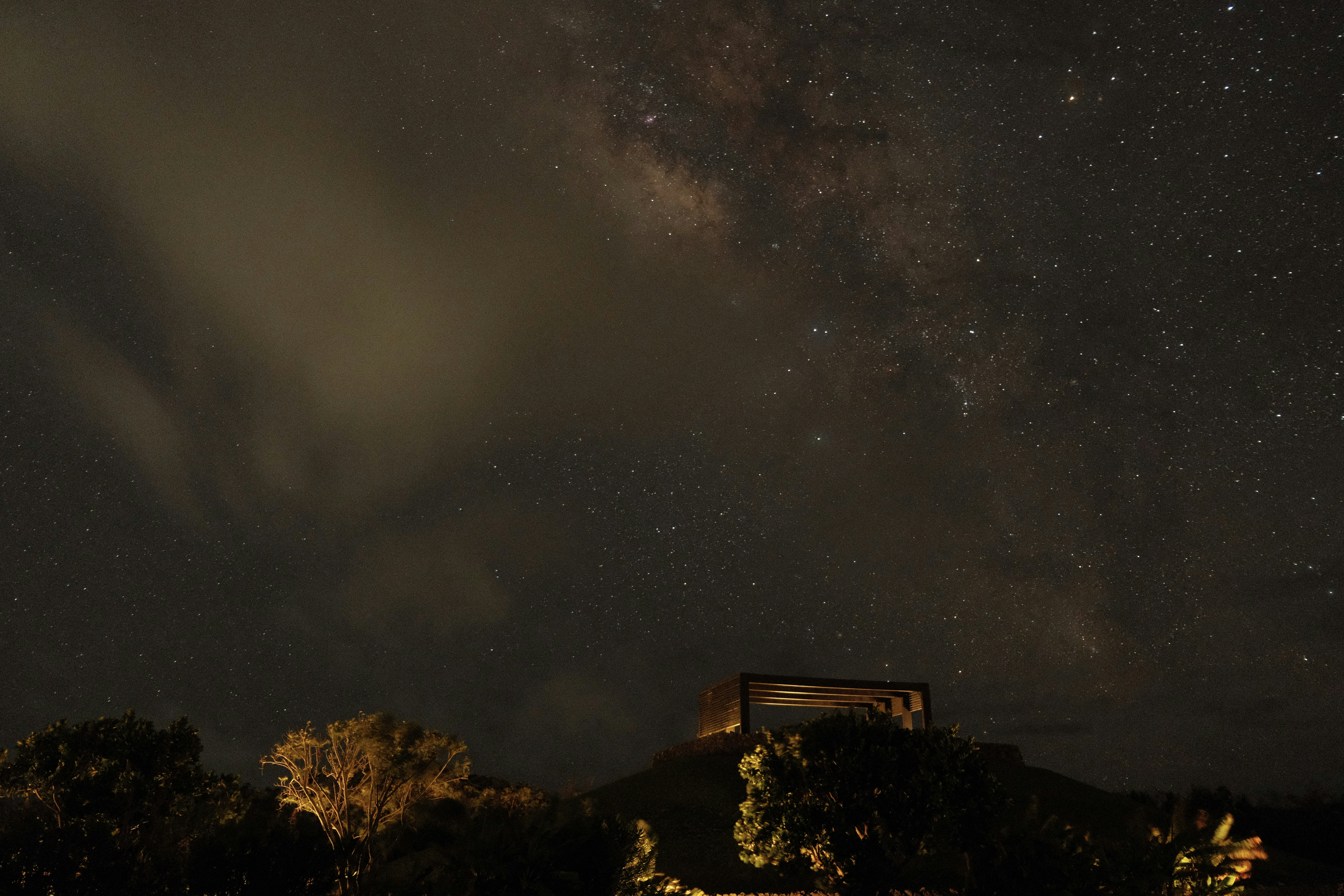 Hilltop Pavilion Beneath a Milky Way Arc