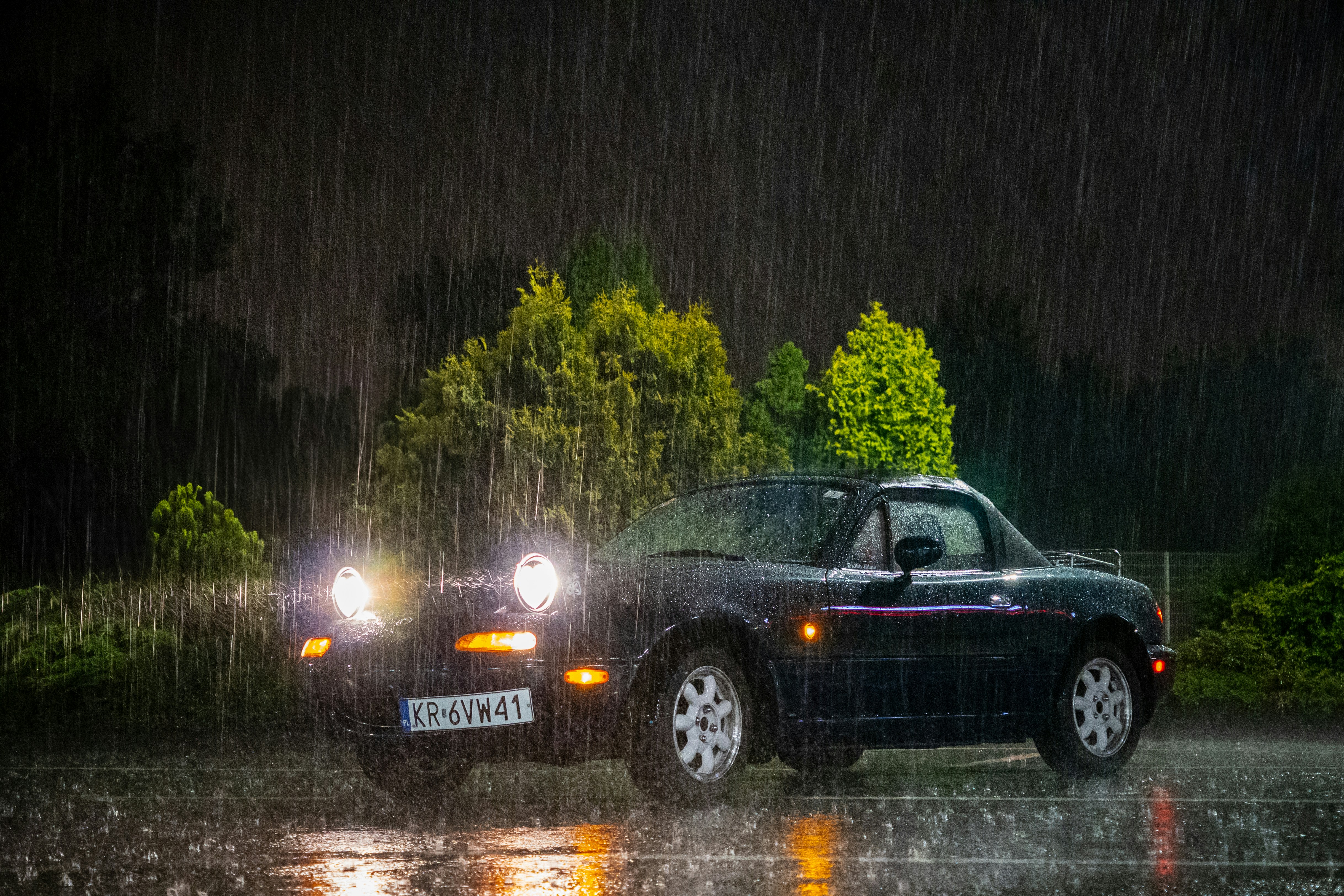 A car driving in the rain at night photo – Free Rainy road Image on ...