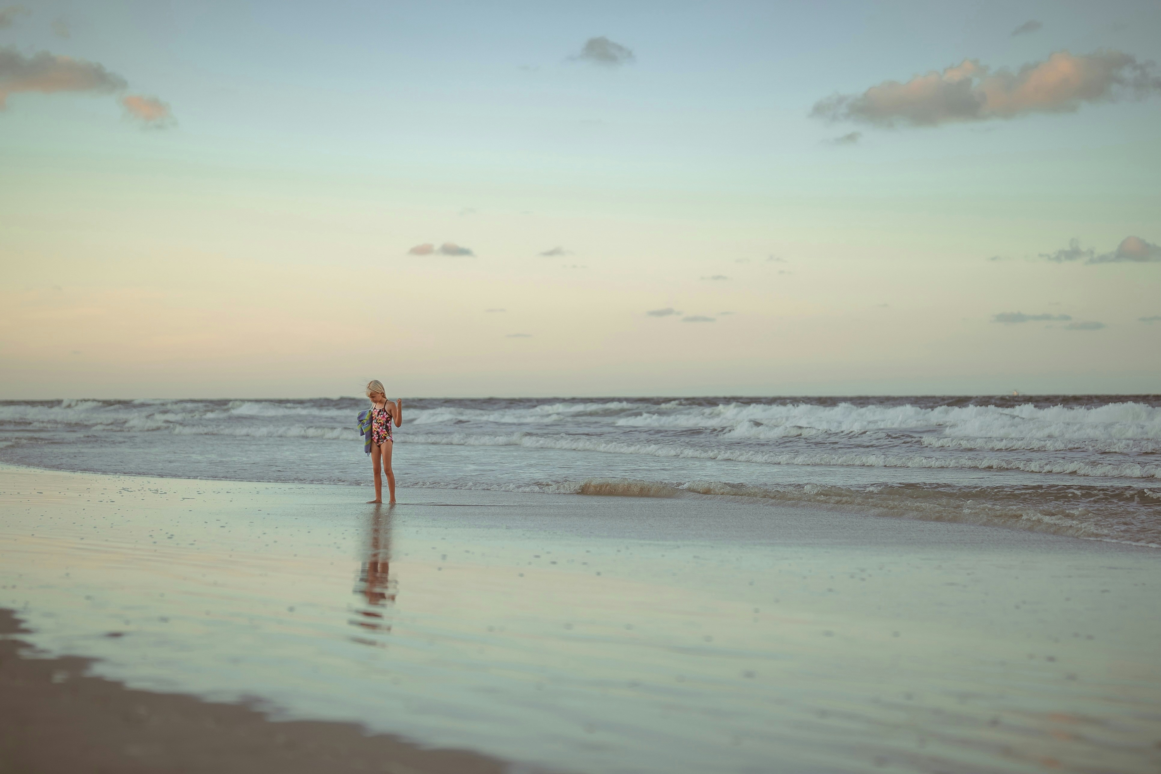 Footprints | A person standing on a beach next to the ocean
