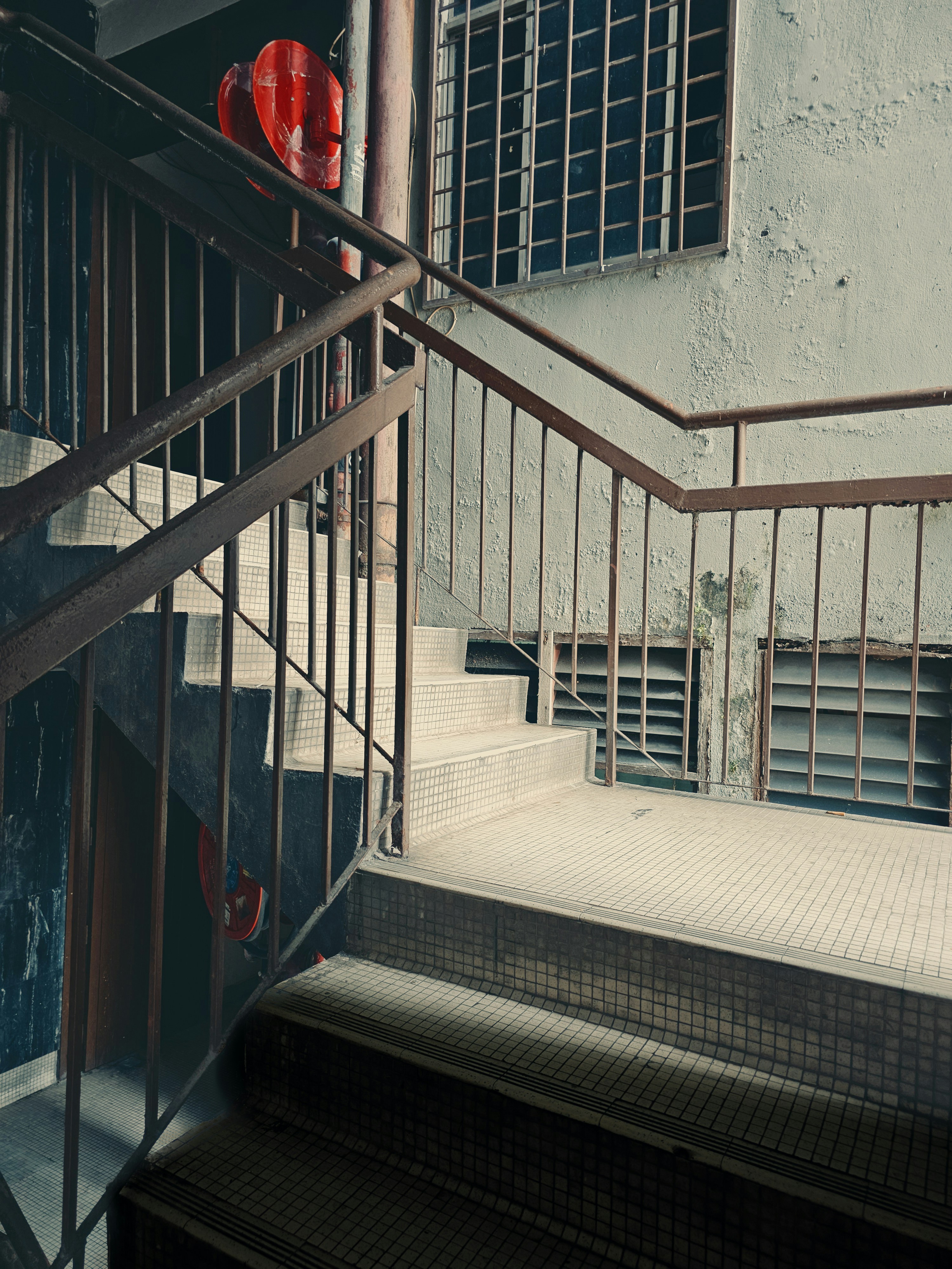 A stairwell leading to a building with a fire hydrant photo – Free ...