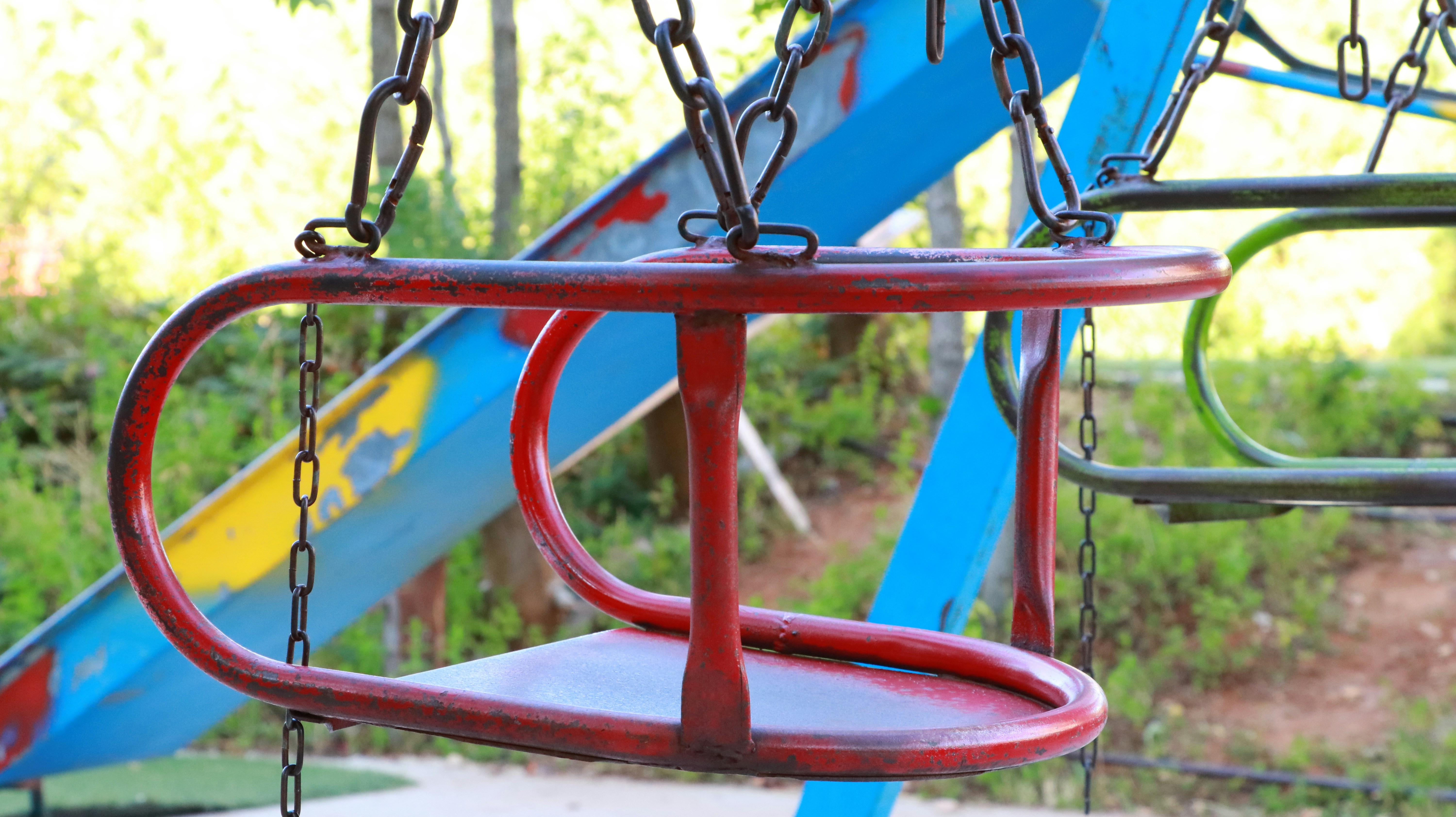 Red Ring Carousel: Chains and Color in a Sunlit Playground