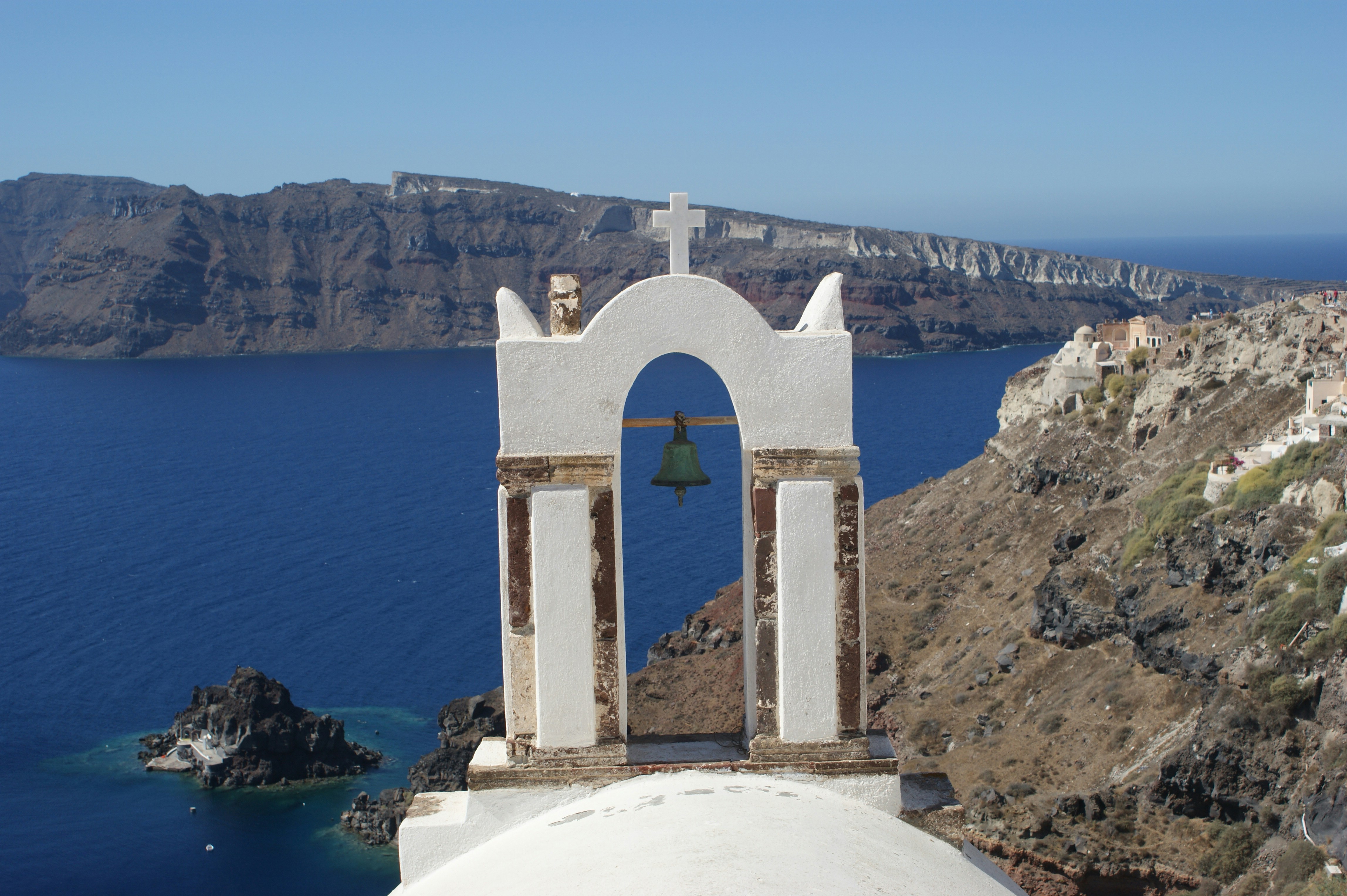 Bell Archway on a Santorini Ridge Framing the Aegean