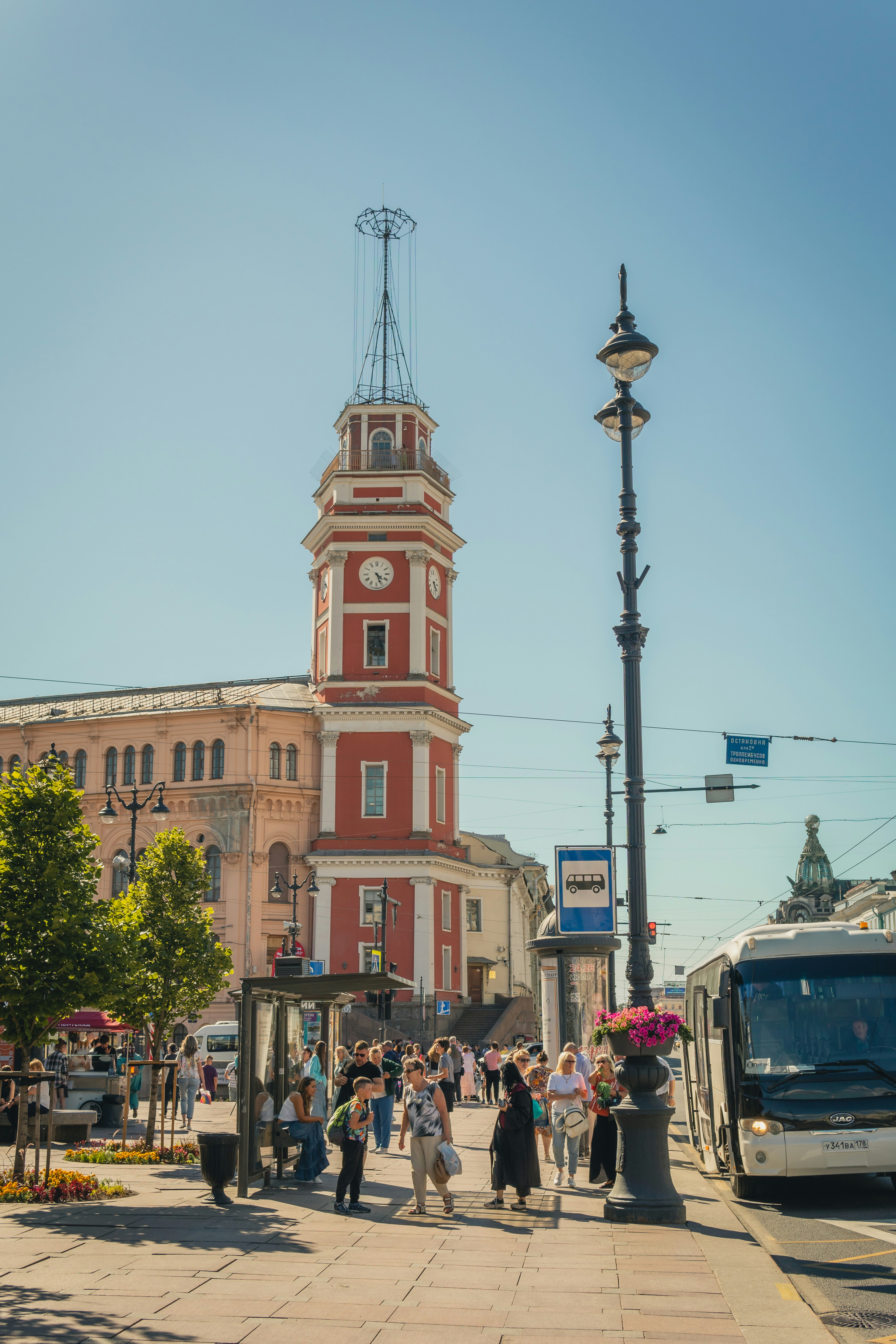 Crimson Clocktower at a Sunlit City Crossing