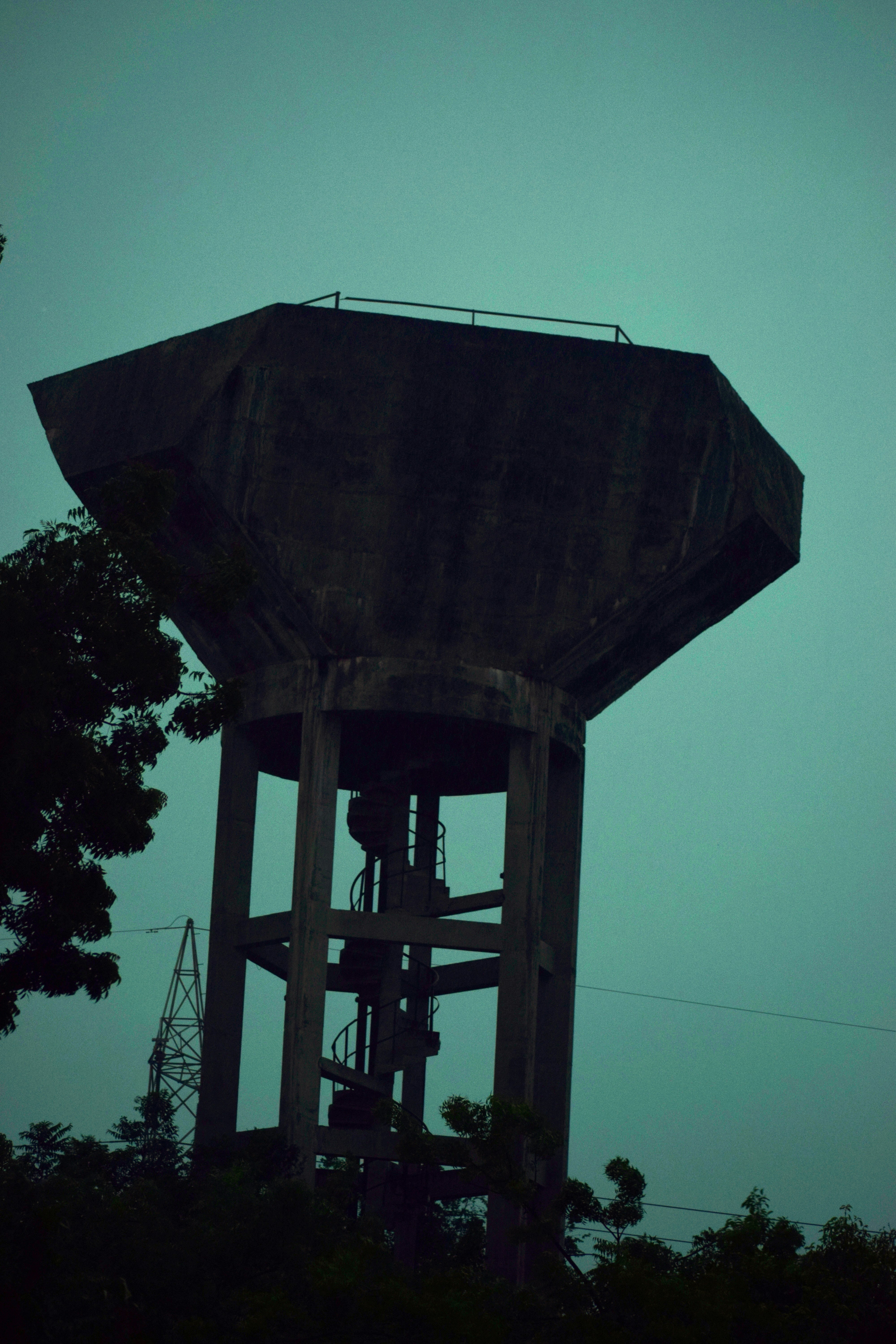 Industrial Watchtower Reaching Toward a Dusky Sky