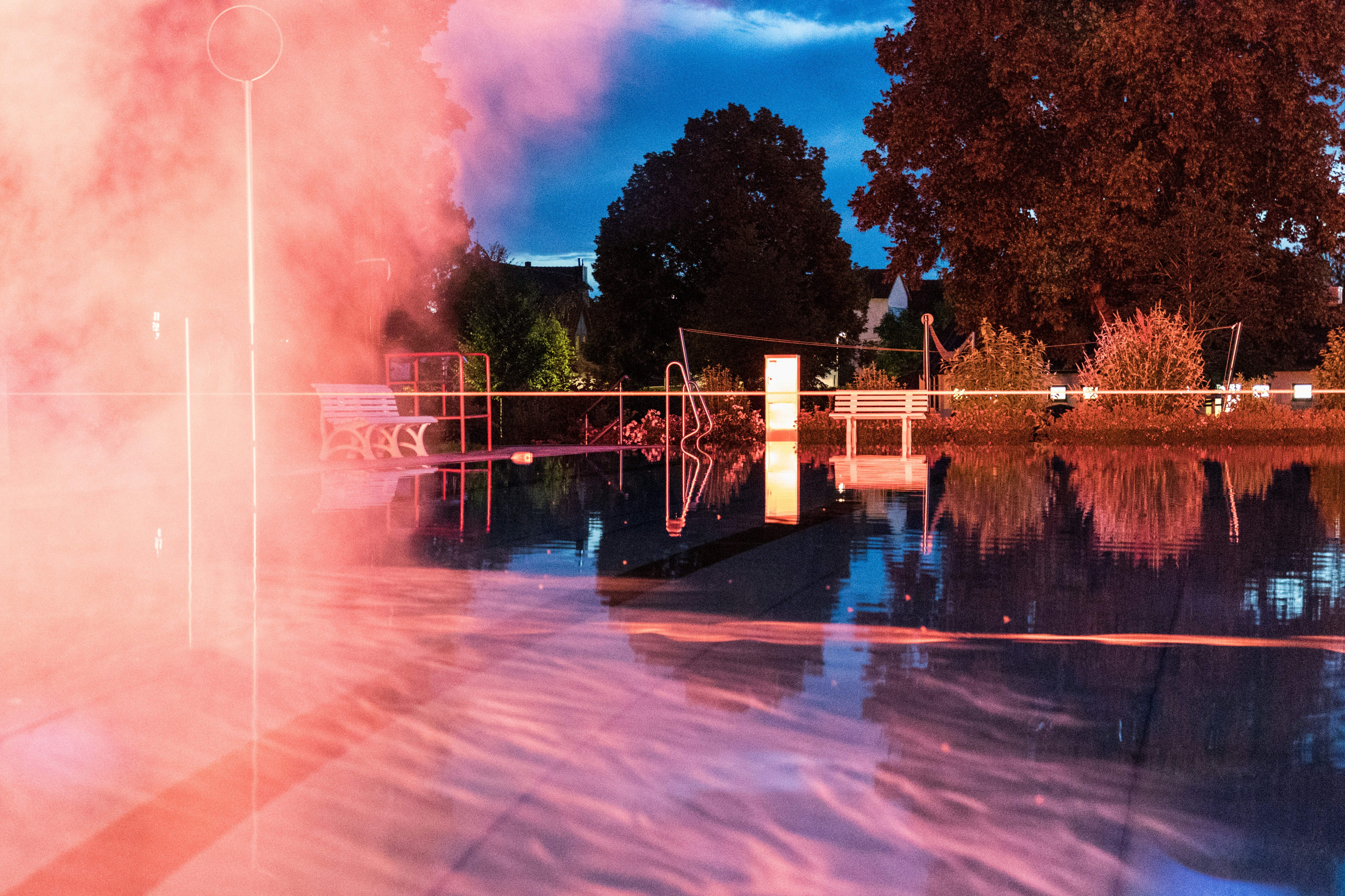 Colored Steam over an Empty Pool: A Quiet Evening at Dusk