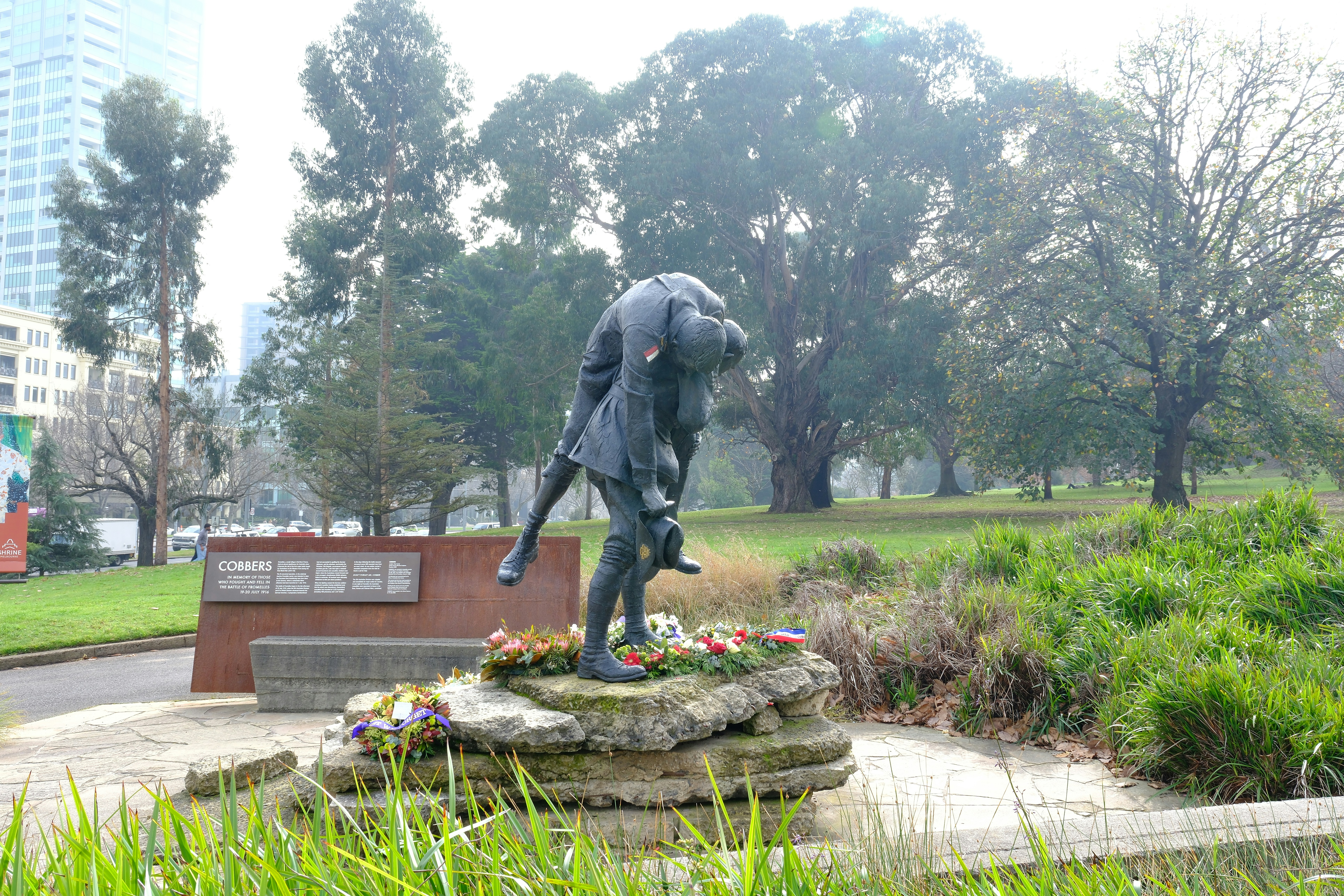 Embrace on Stone: Bronze Lovers in a City Park