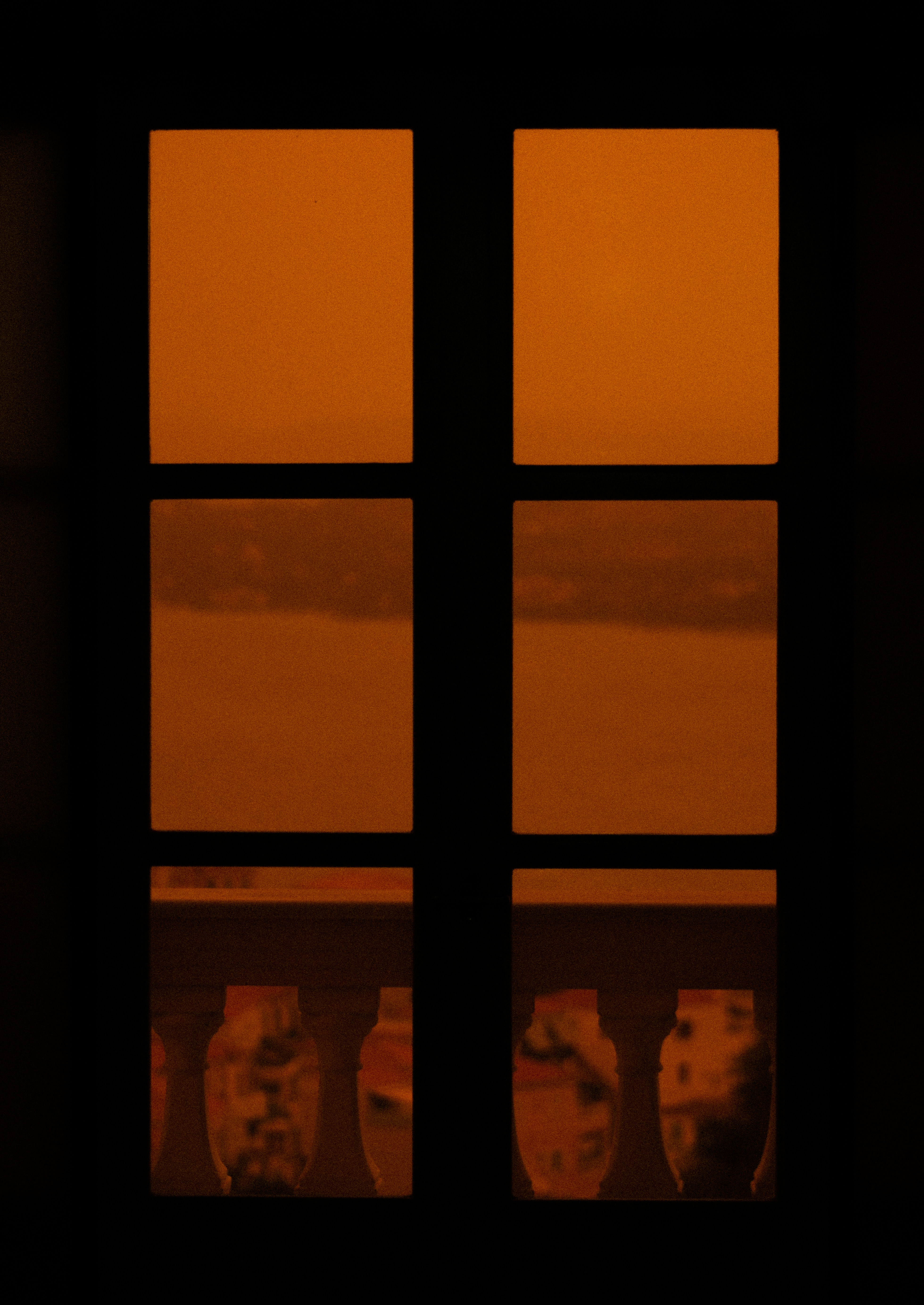 Ember Grid: Dusk Light Filtering Through a Six-Pane Window