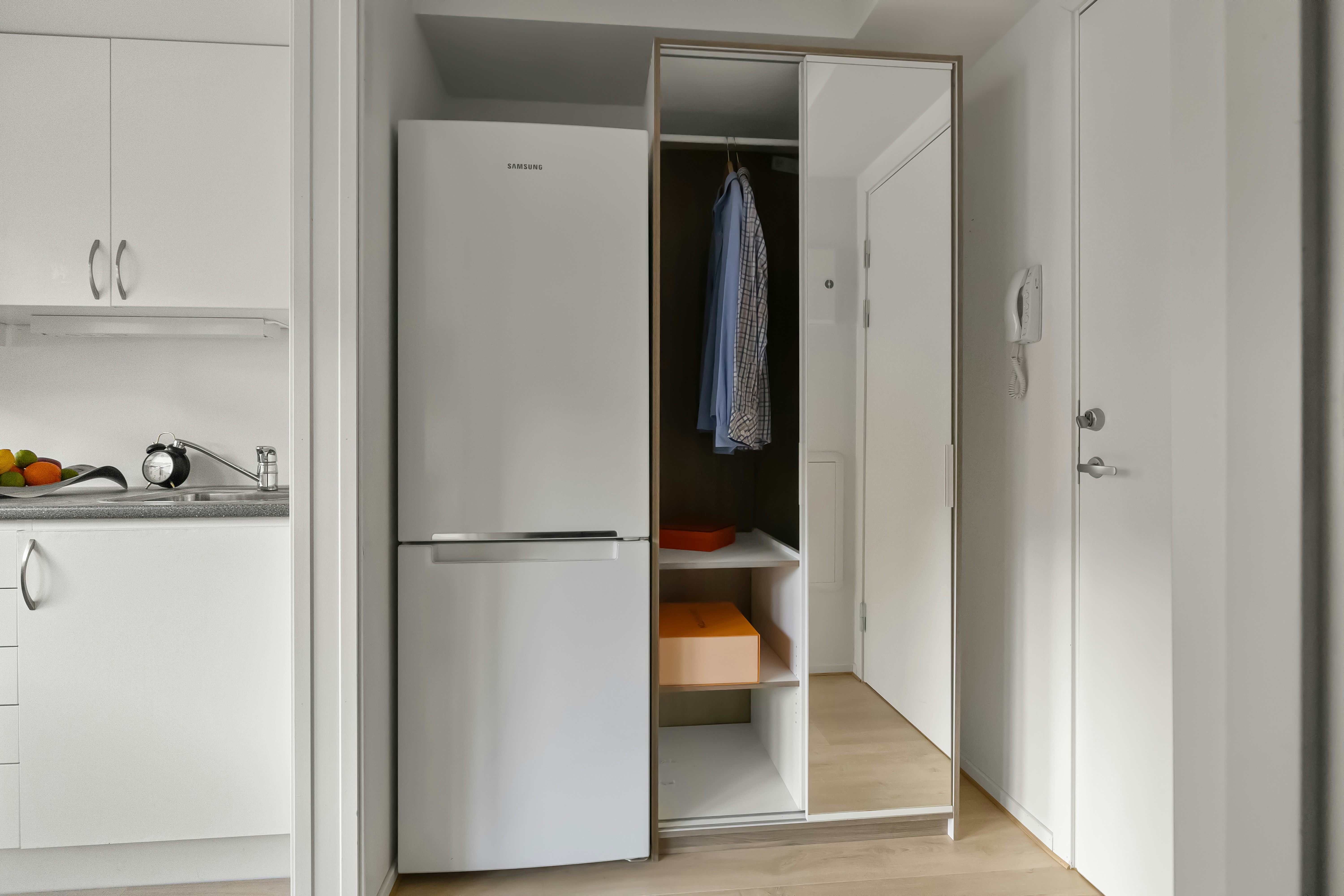 A kitchen with white cabinets and a white refrigerator photo – Free ...