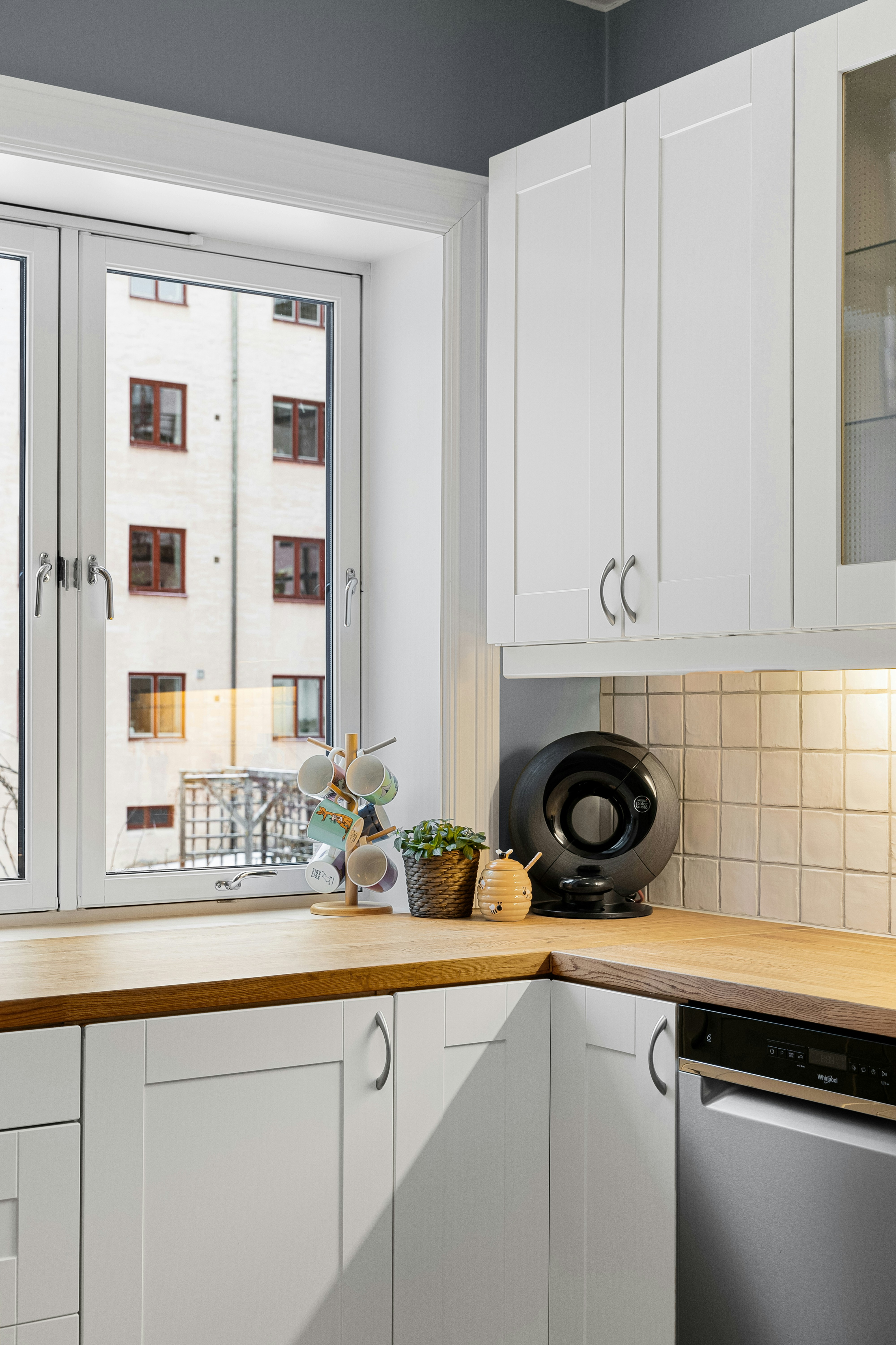 A kitchen with a sink, dishwasher and a window photo – Free Indoors ...