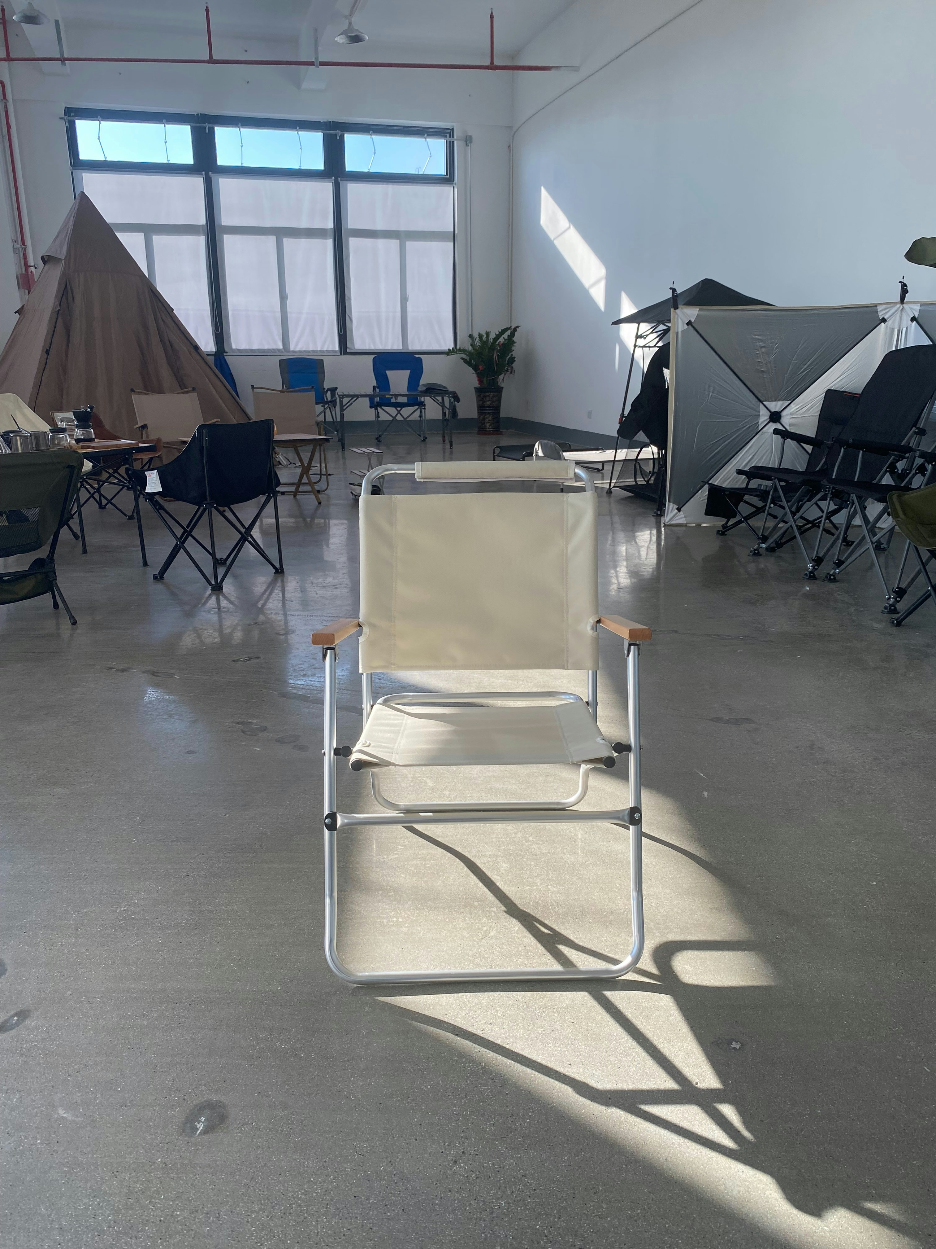 Solitary Folding Chair Anchors a Sunlit Studio Set