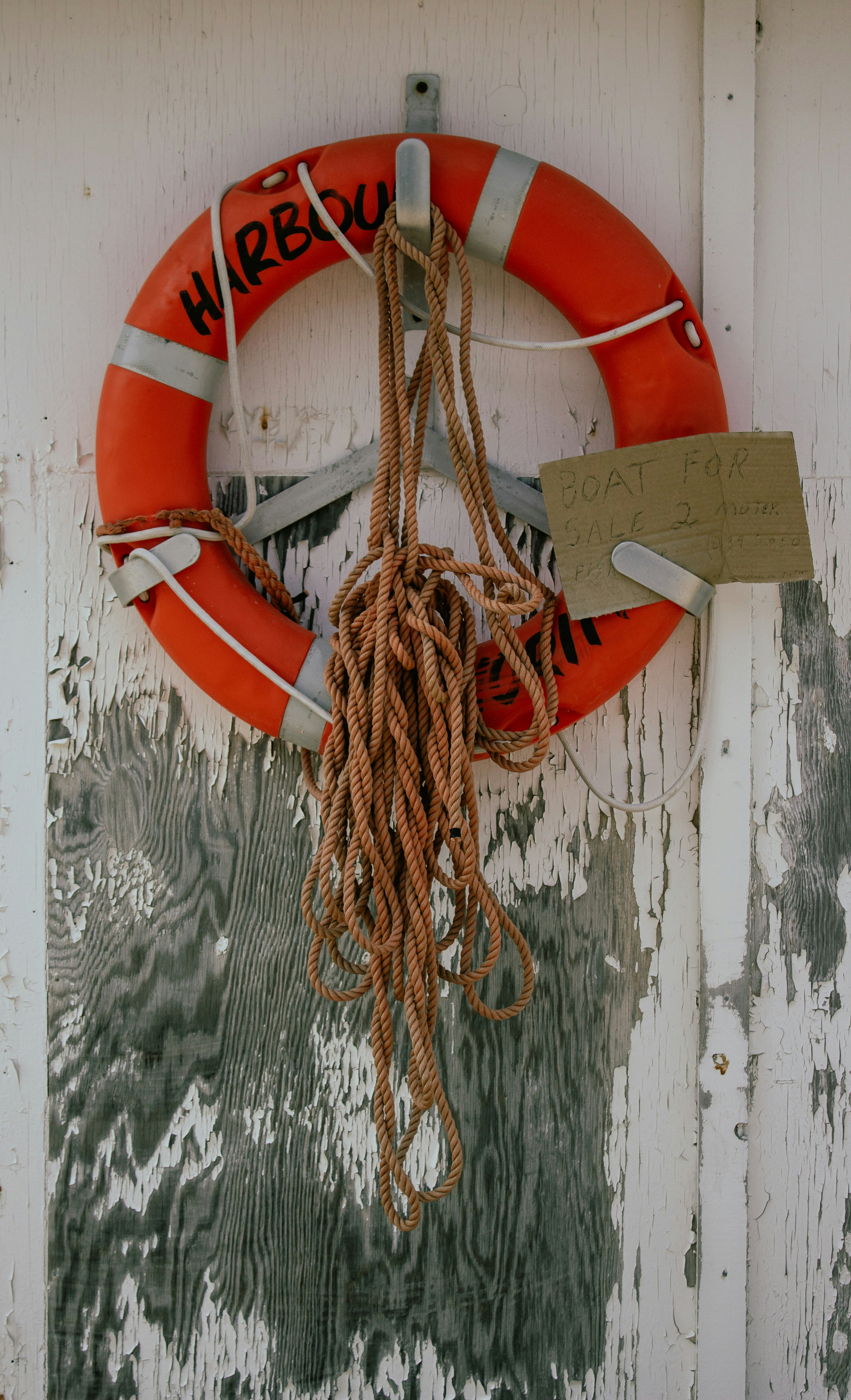Red Lifebuoy on a Weathered Wharf: Tangled Ropes and Peeling Paint