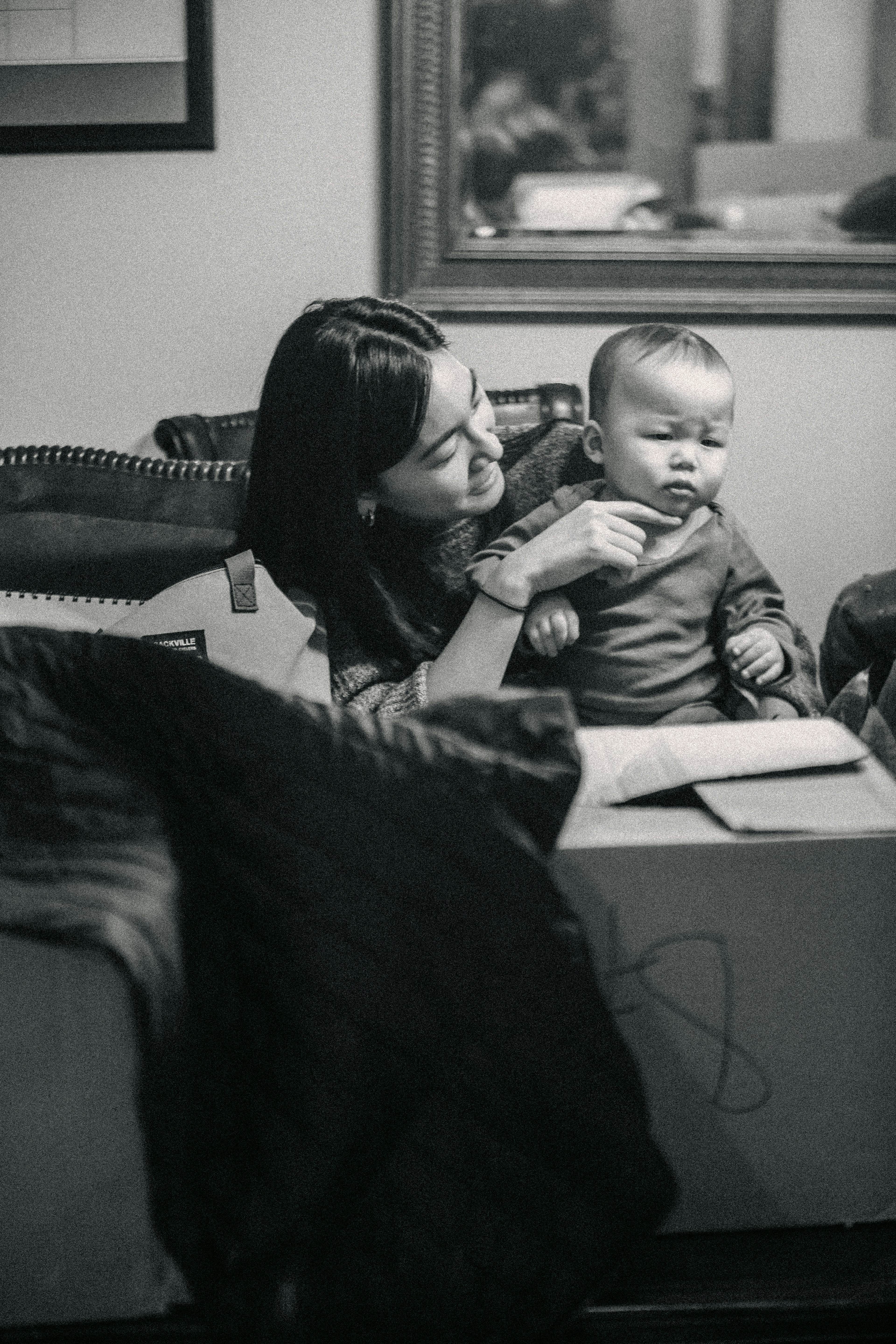 A black and white photo of a woman holding a baby photo – Free Woman ...