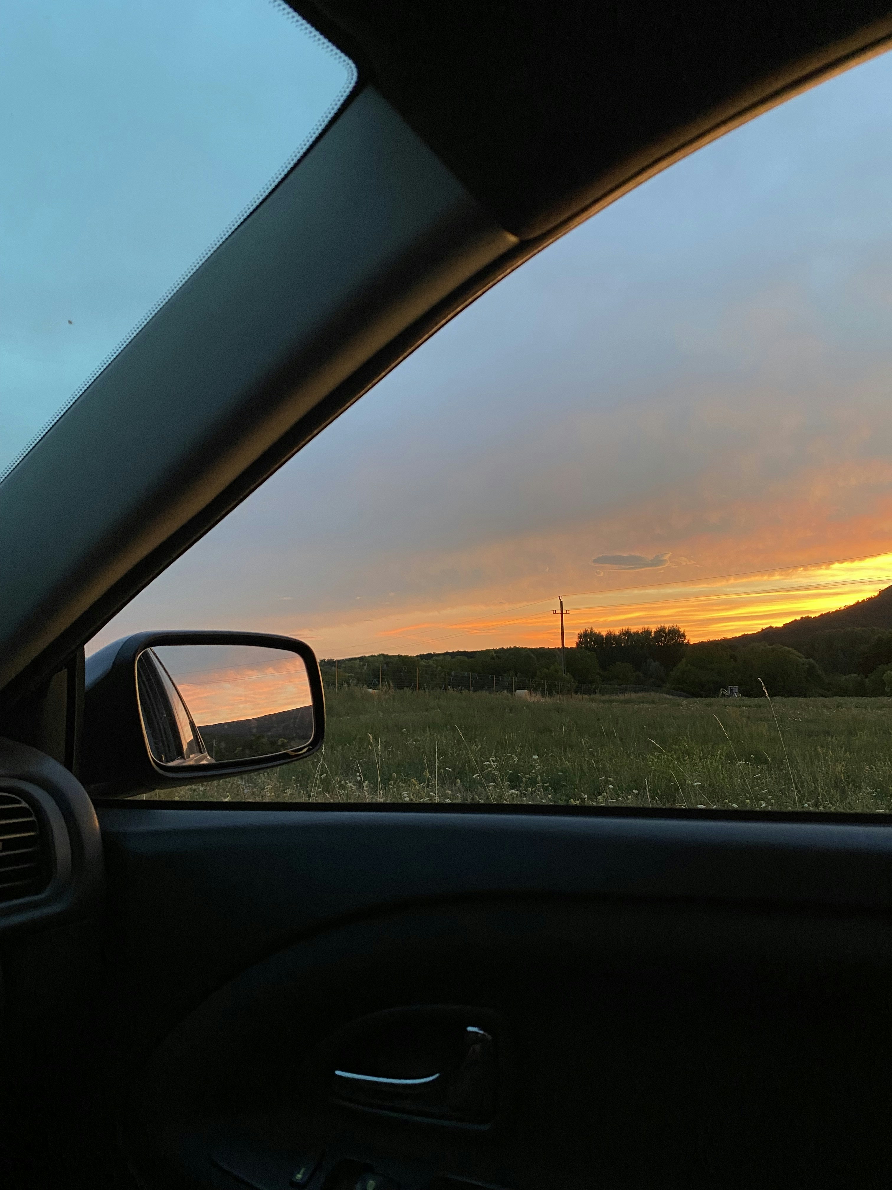 A view of a sunset from inside a car photo – Free Car Image on Unsplash