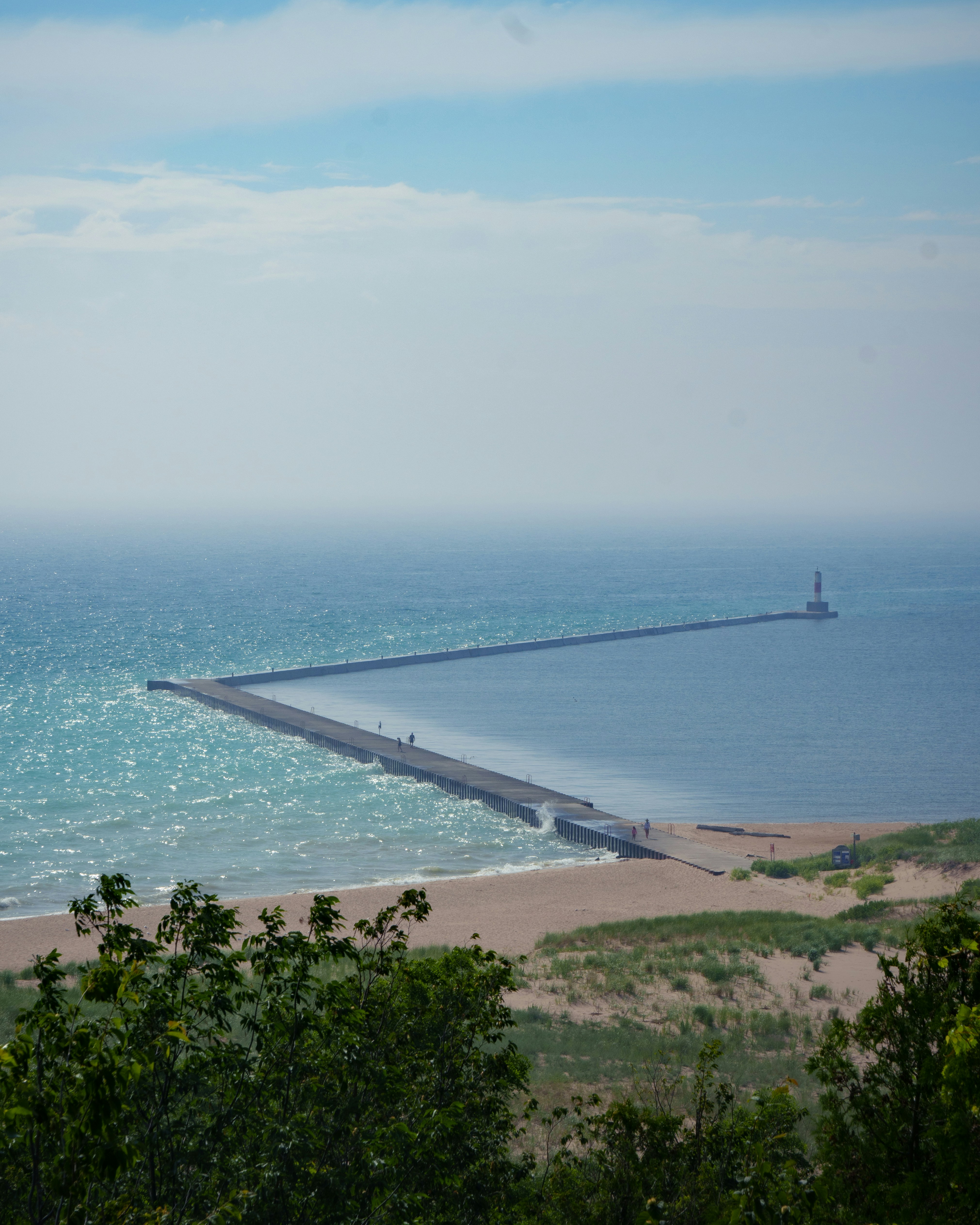 Azure Breakwater to the Horizon: A Quiet Pier Reaches Toward the Sea