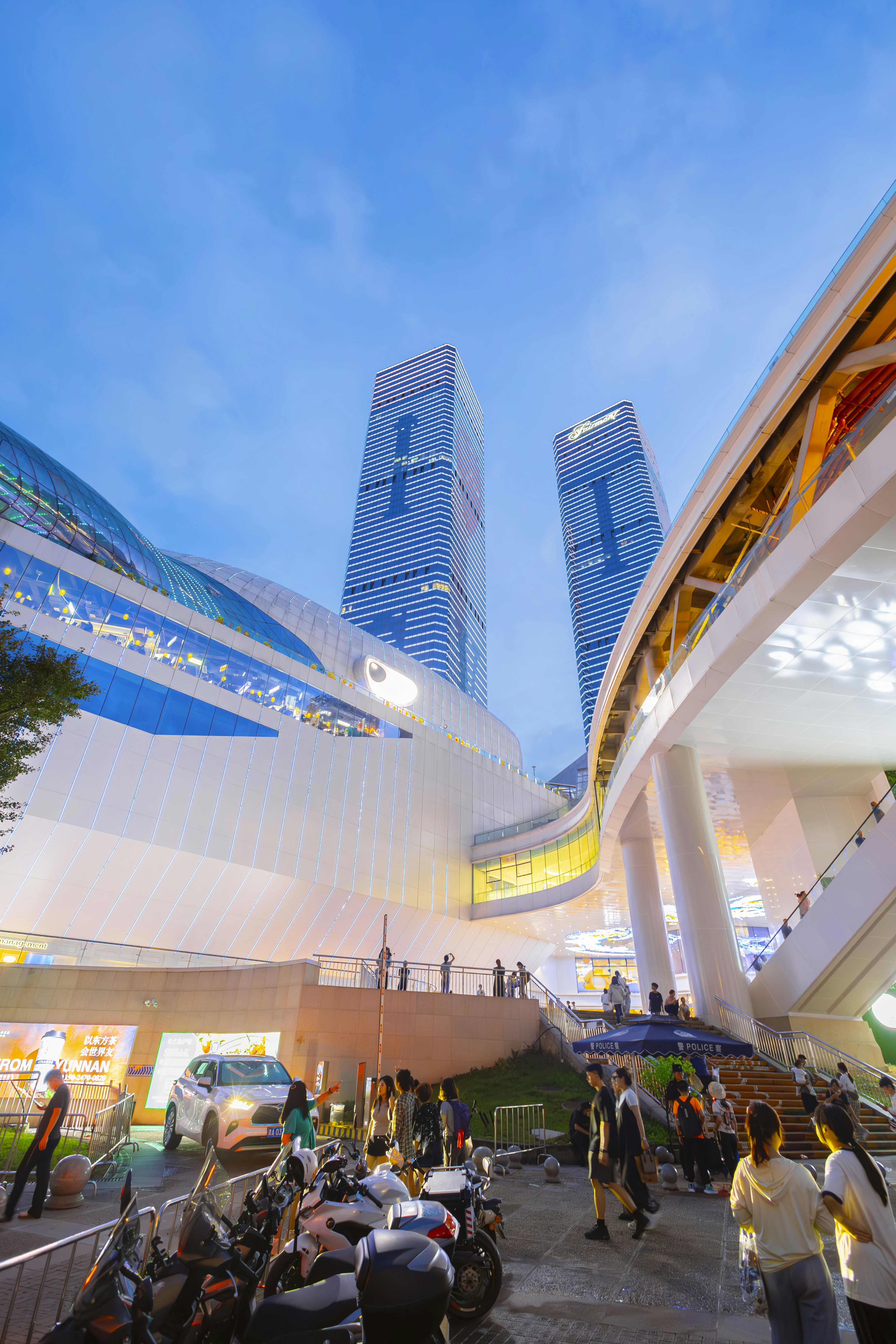 Twin Towers Above the Curved Canopy: A Blue Hour Urban Ballet