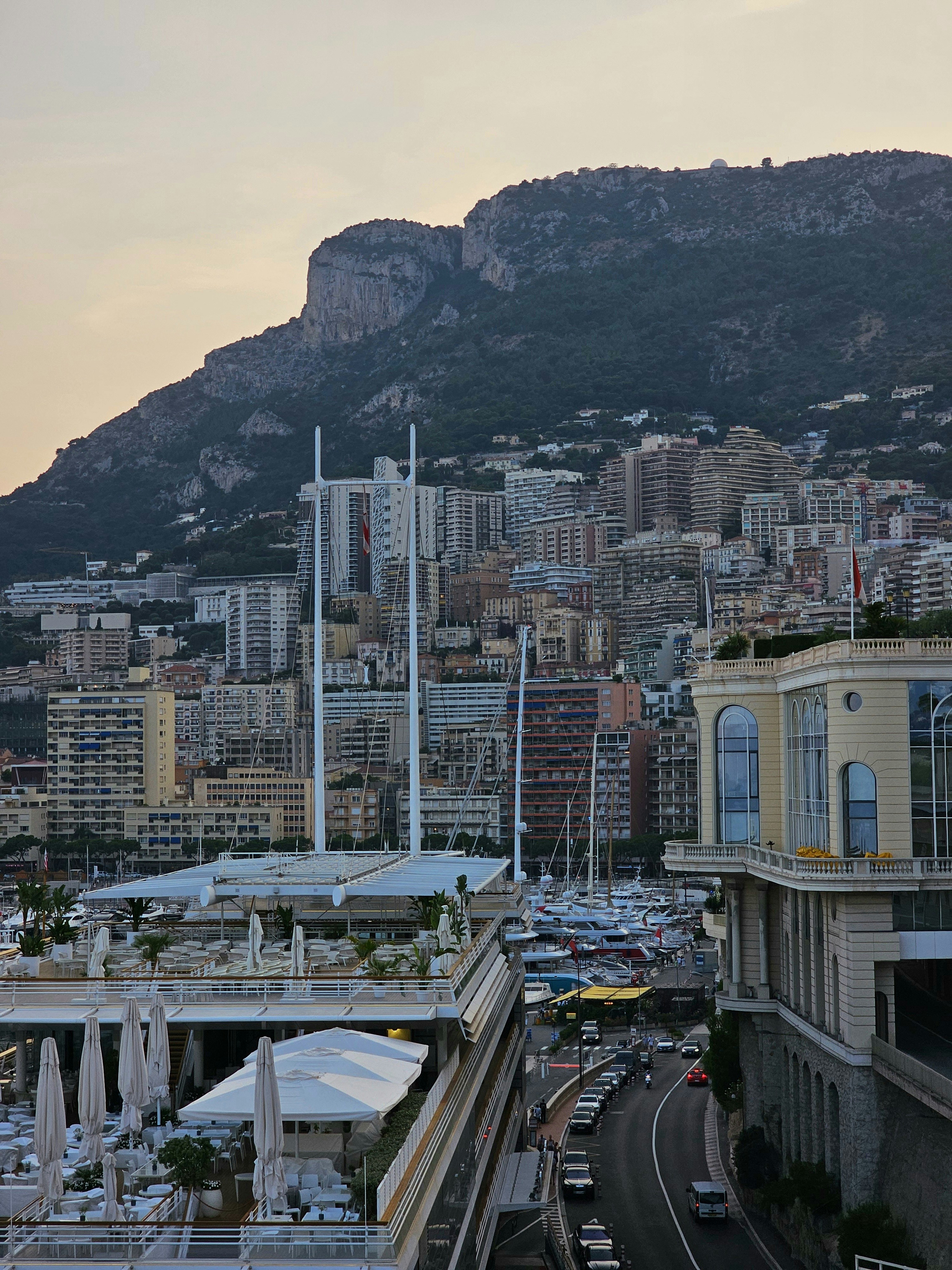 Harborfront Highrise Panorama: Cliffside City at Dusk