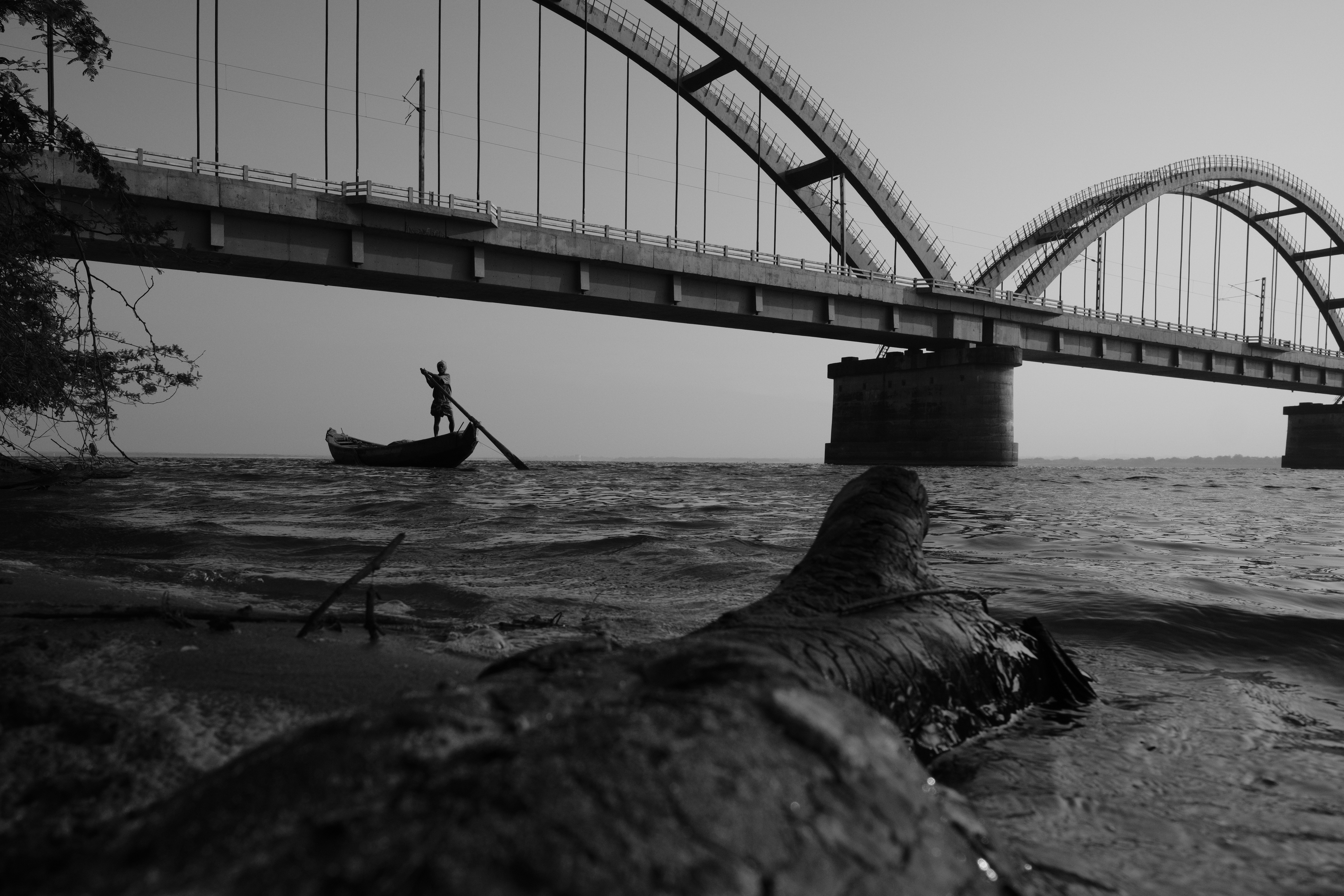 Solitary Boatman Beneath the Arched Bridge