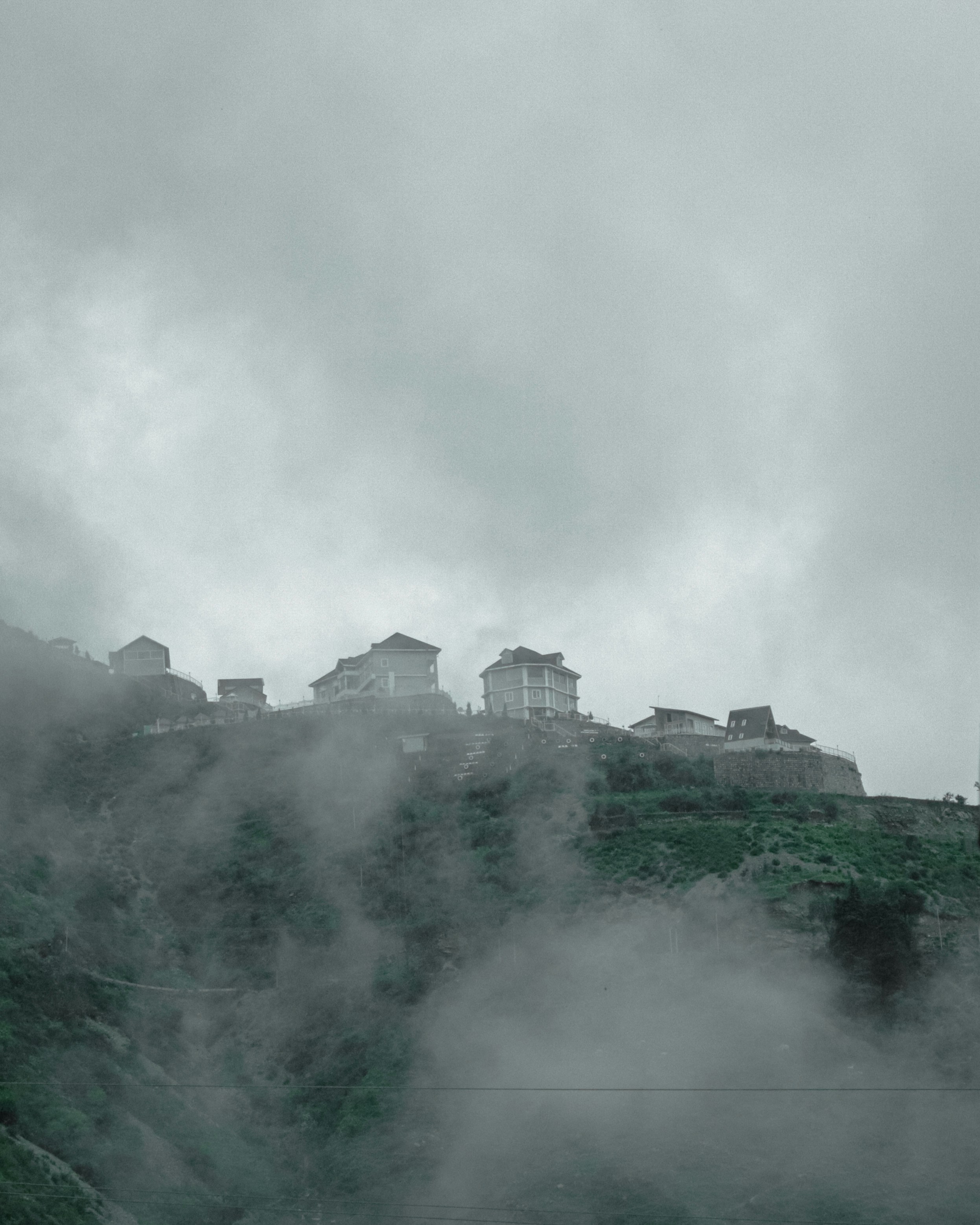 Mist-Laced Ridge: A Summit Village Crowned by Cloud