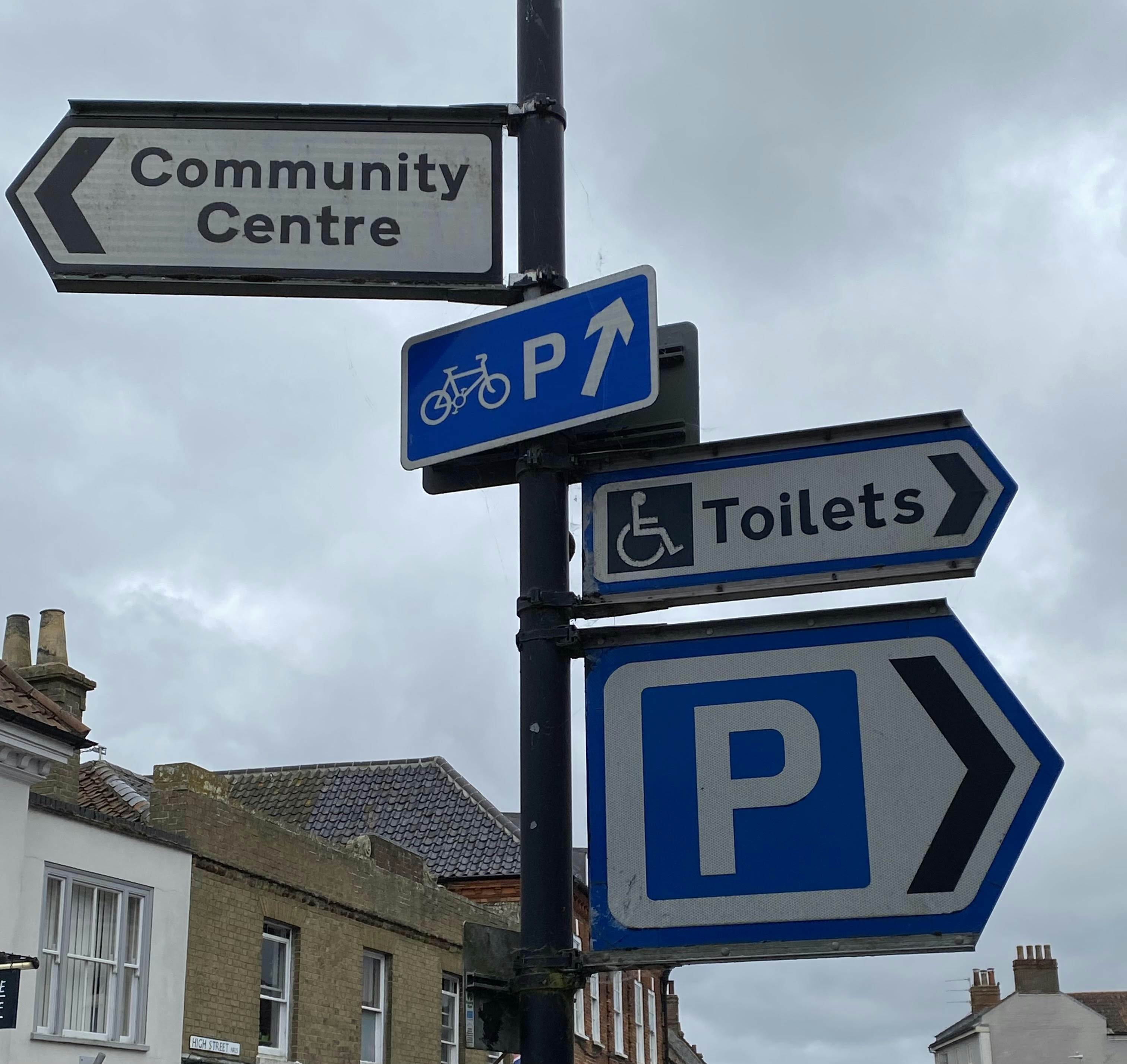 A pole with several street signs on it photo – Free Street signs Image ...