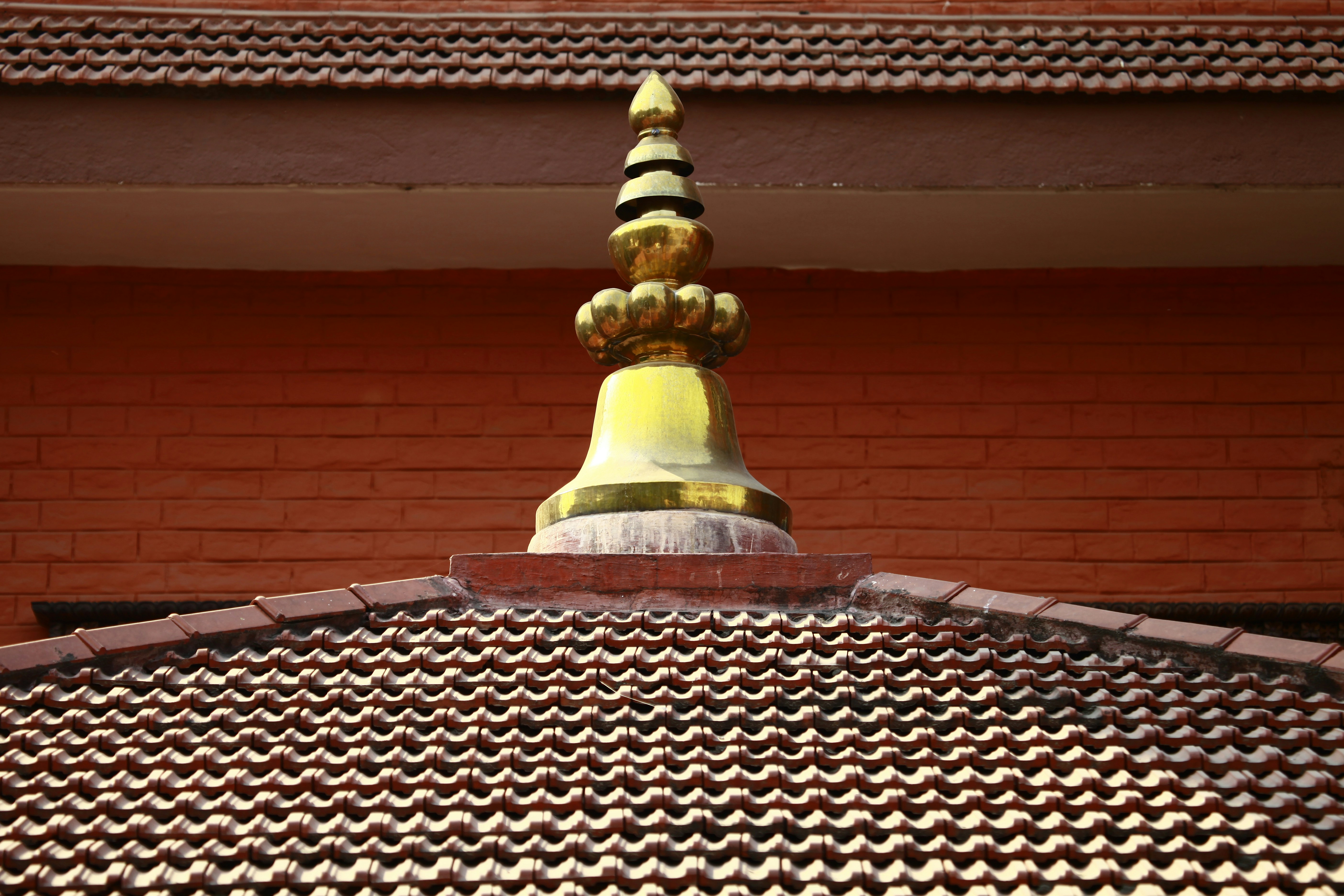 Gilded Spire Above Terracotta Tiles