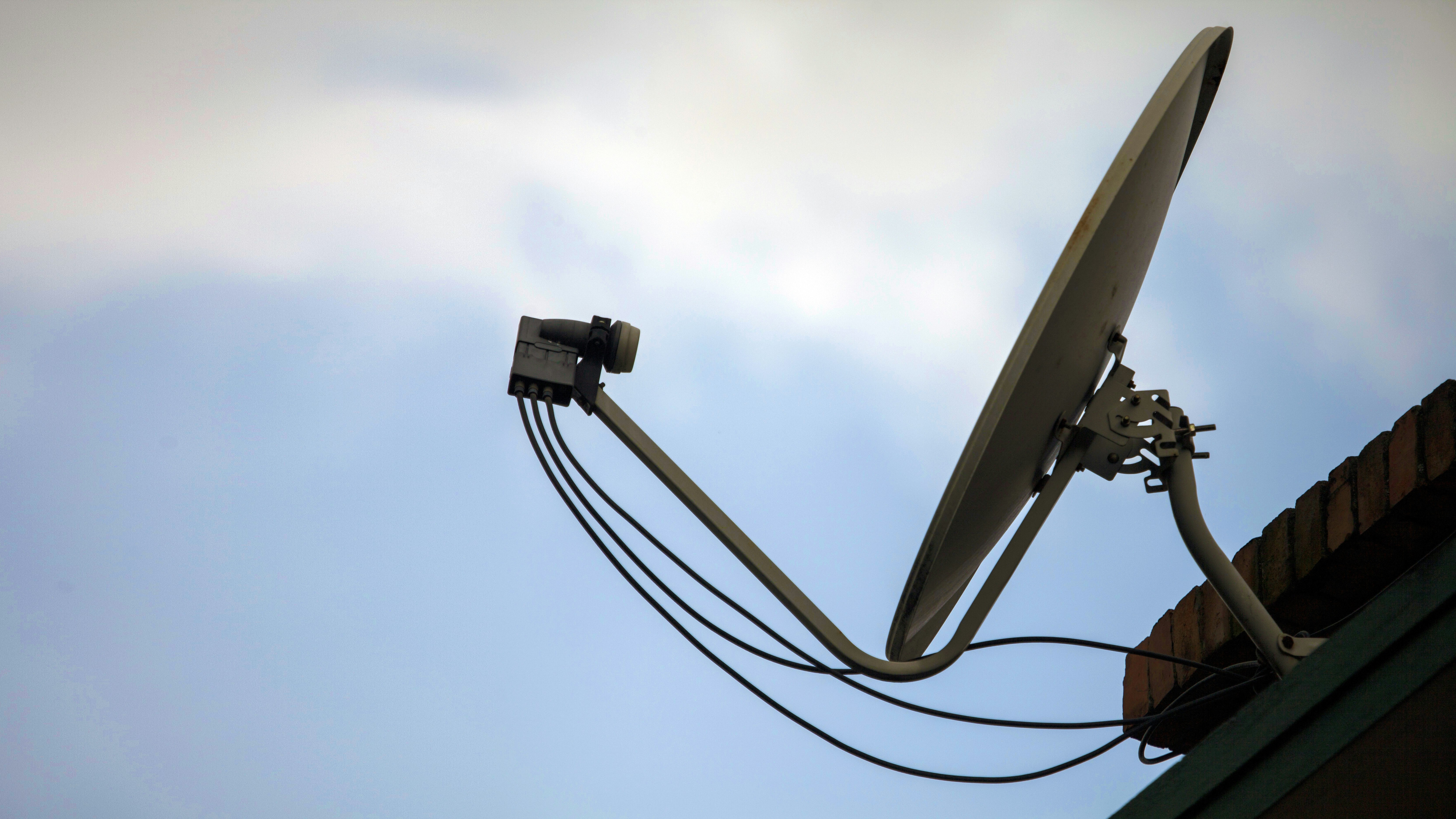 Rooftop Satellite Dish Reaches Toward the Sky