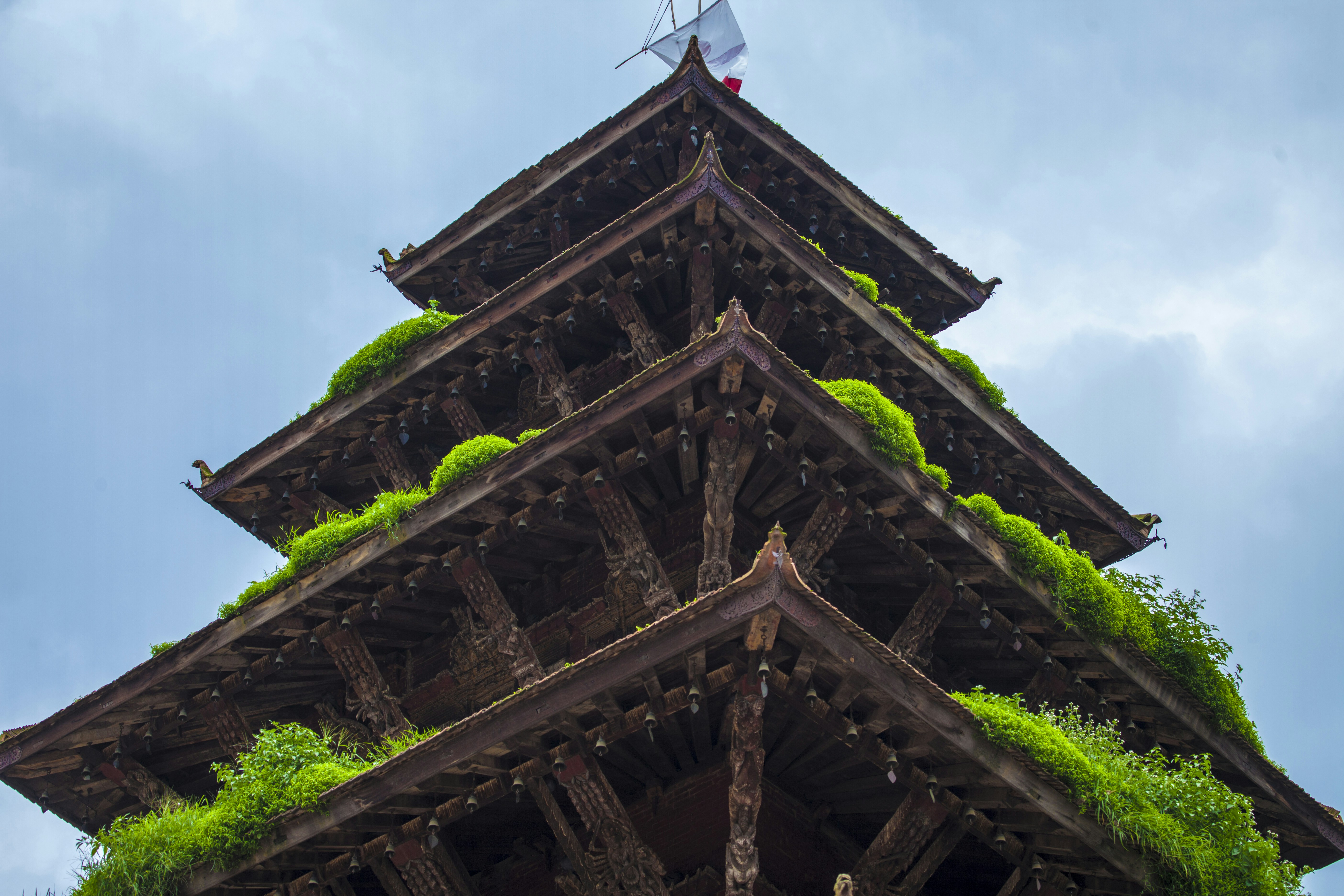 A tall wooden tower with a green roof photo – Free Building Image on ...
