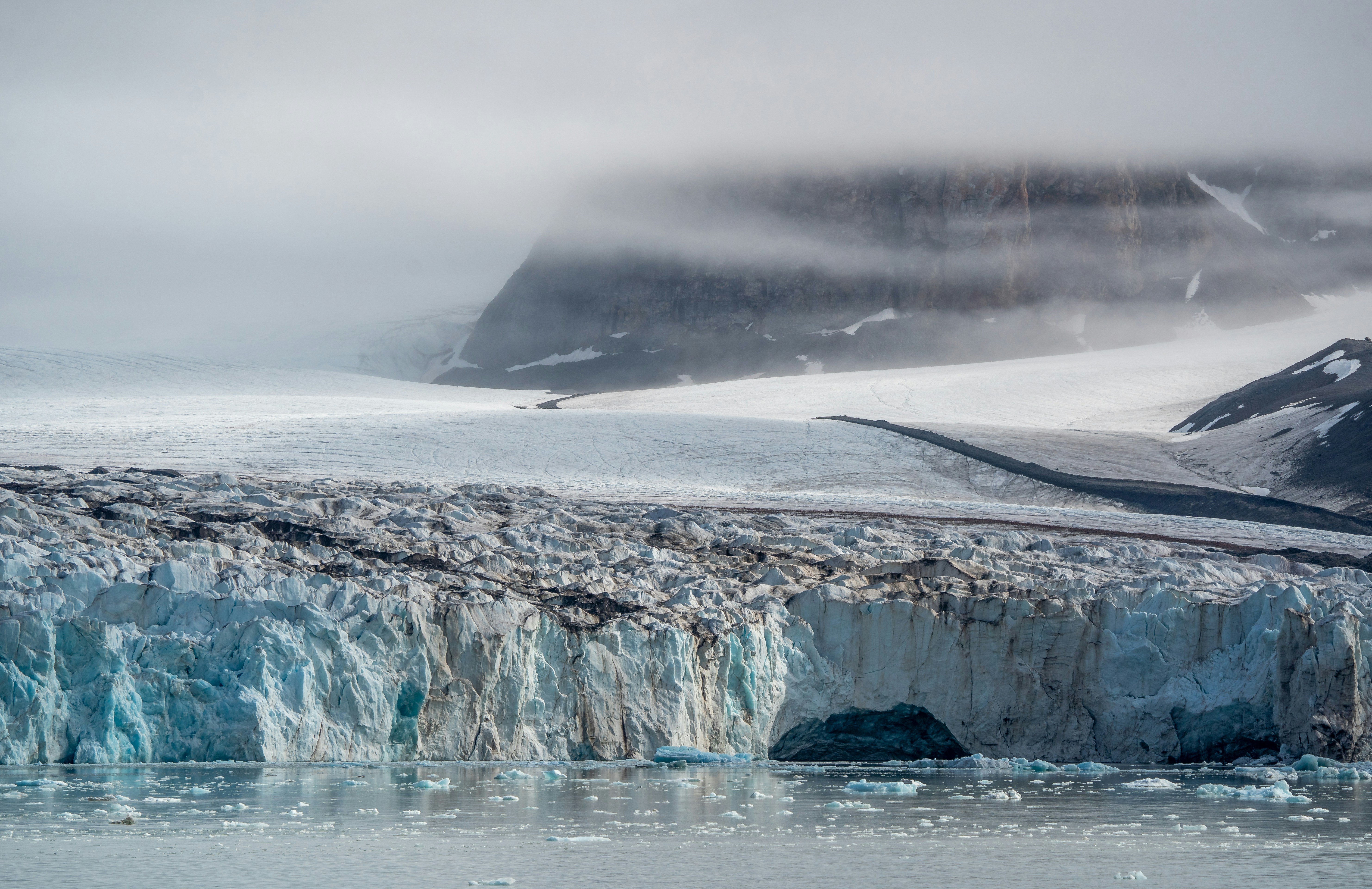 A large glacier with a mountain in the background photo – Free Glacier ...