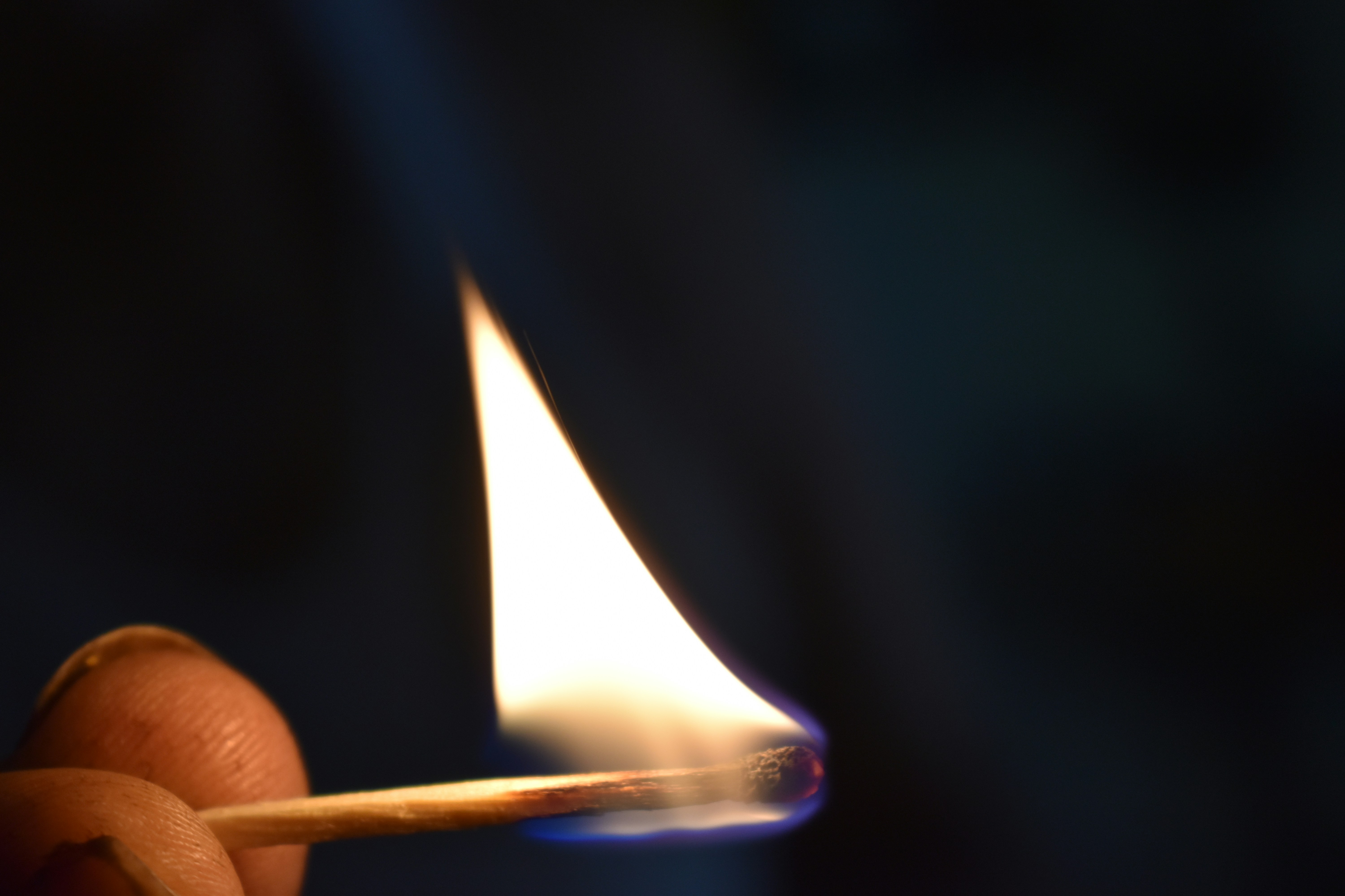Ignition in the Shadow: A Close-Up of a Lit Match